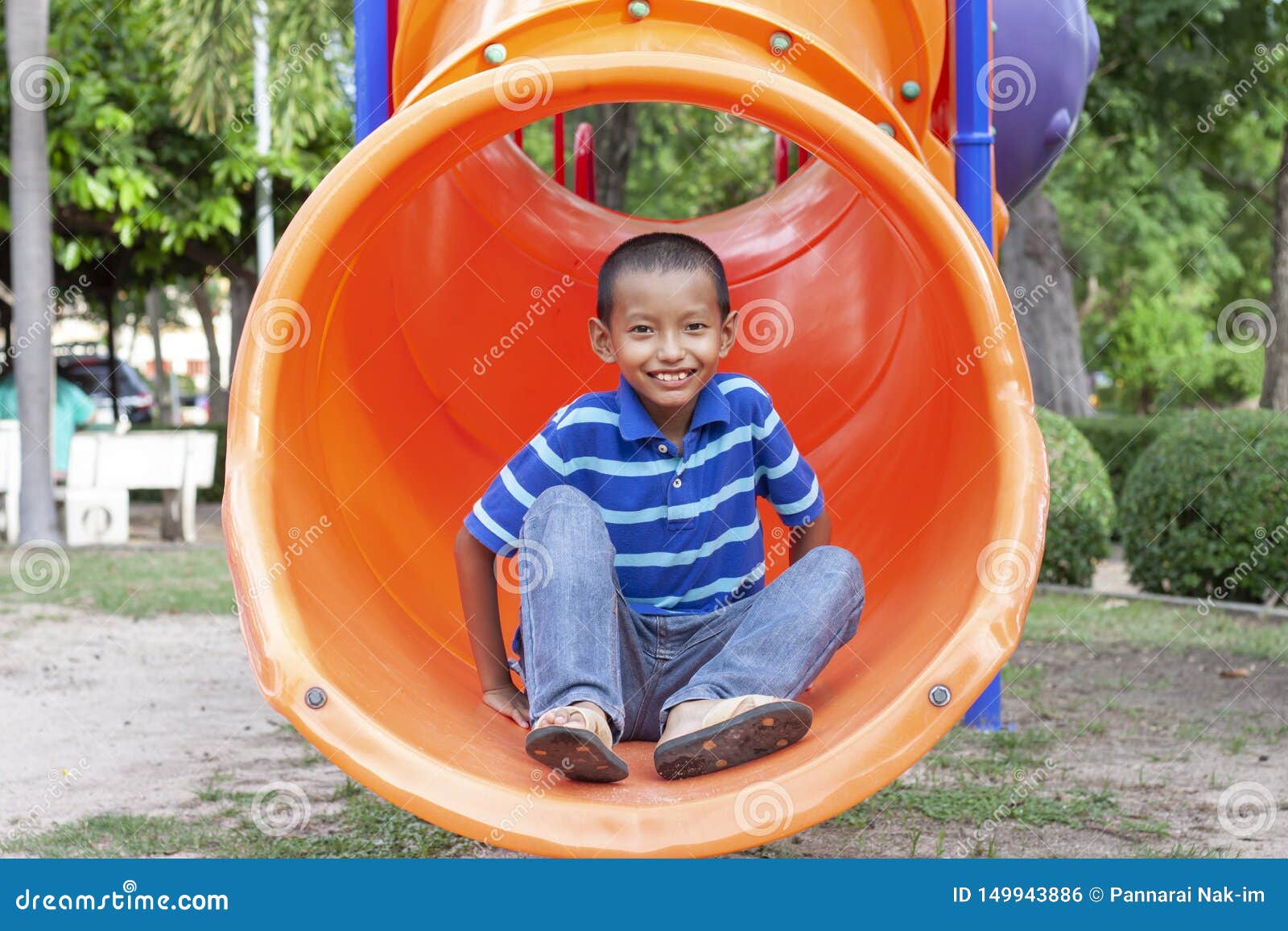 Boy Playing the Slide on the Playground. Stock Photo - Image of little ...