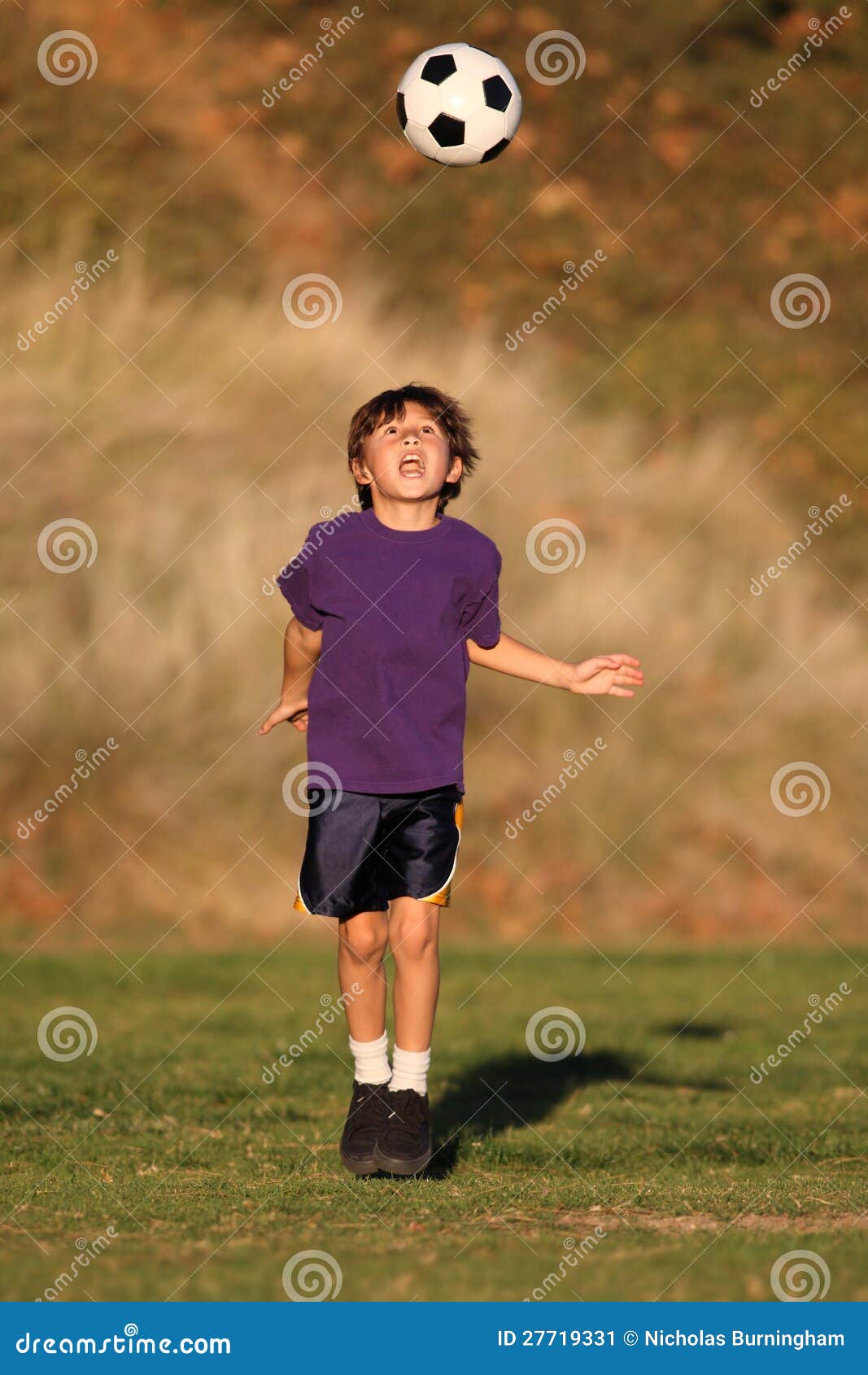 Boy Playing with Soccer Ball in Fall Stock Image - Image of people ...