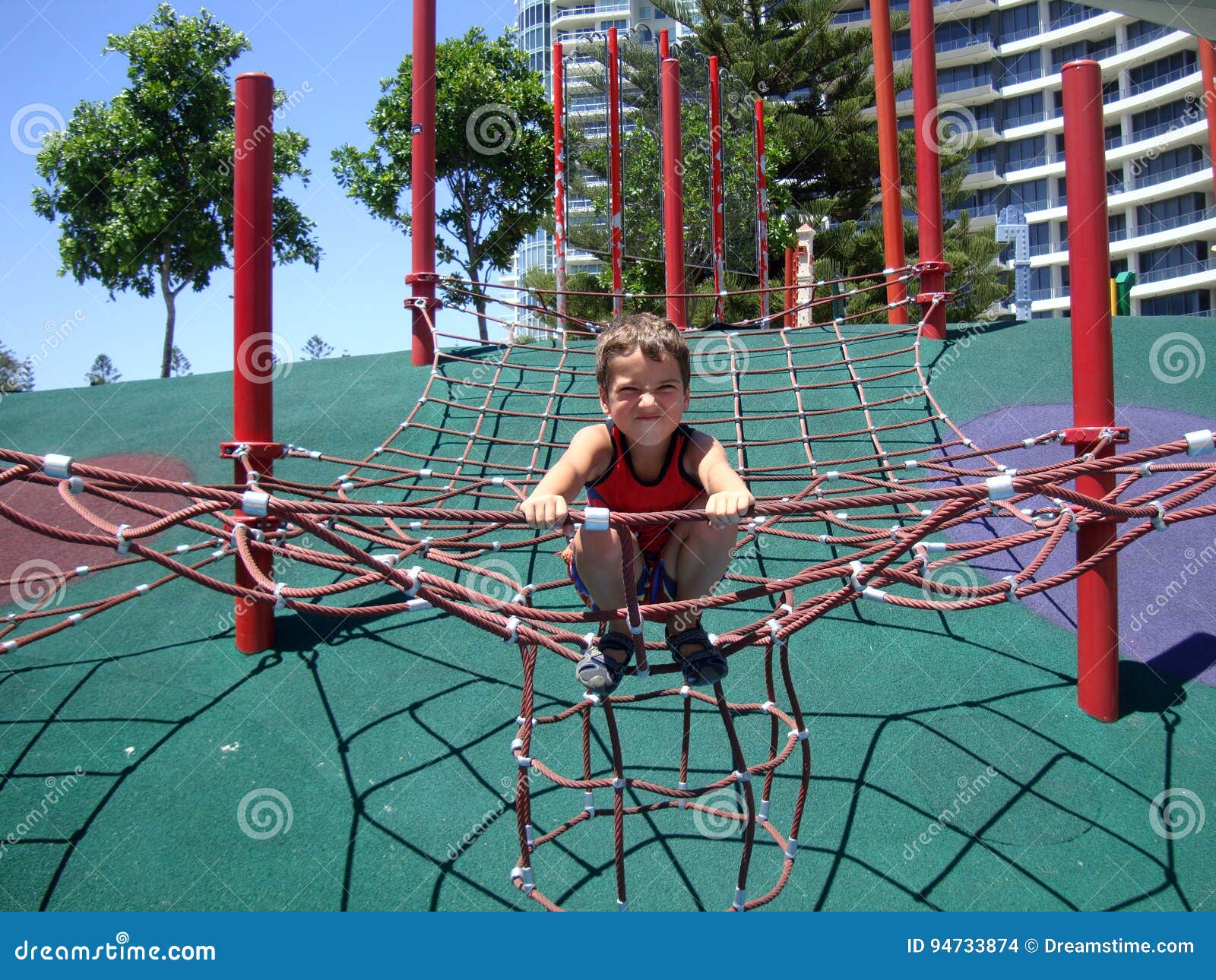 A Boy is Playing in a Spider Web Stock Photo - Image of playing ...