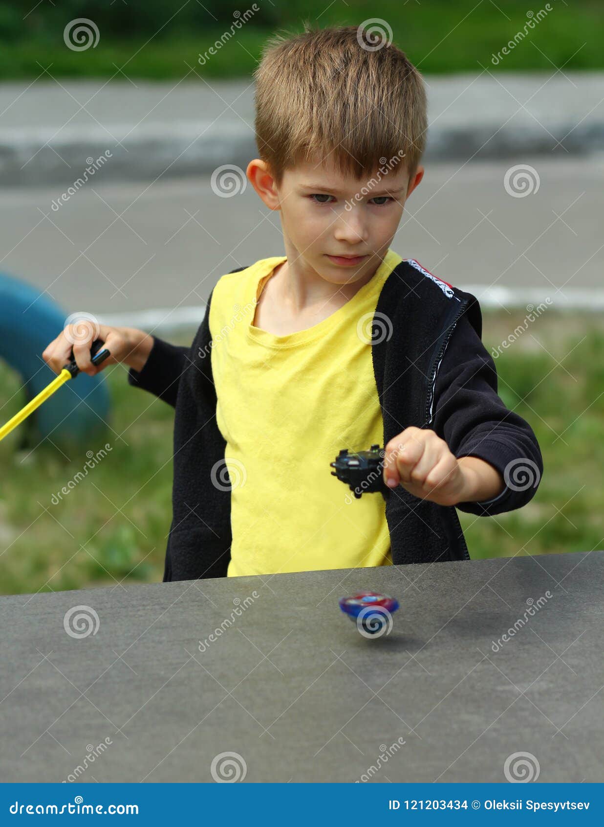 Boy Playing with a Spinning Top Stock Photo - Image of playground ...
