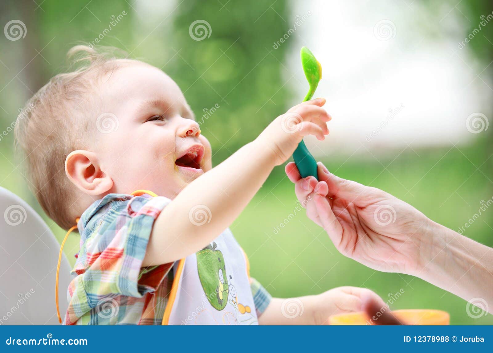 Boy playing with spoon stock photo. Image of appetizing - 12378988
