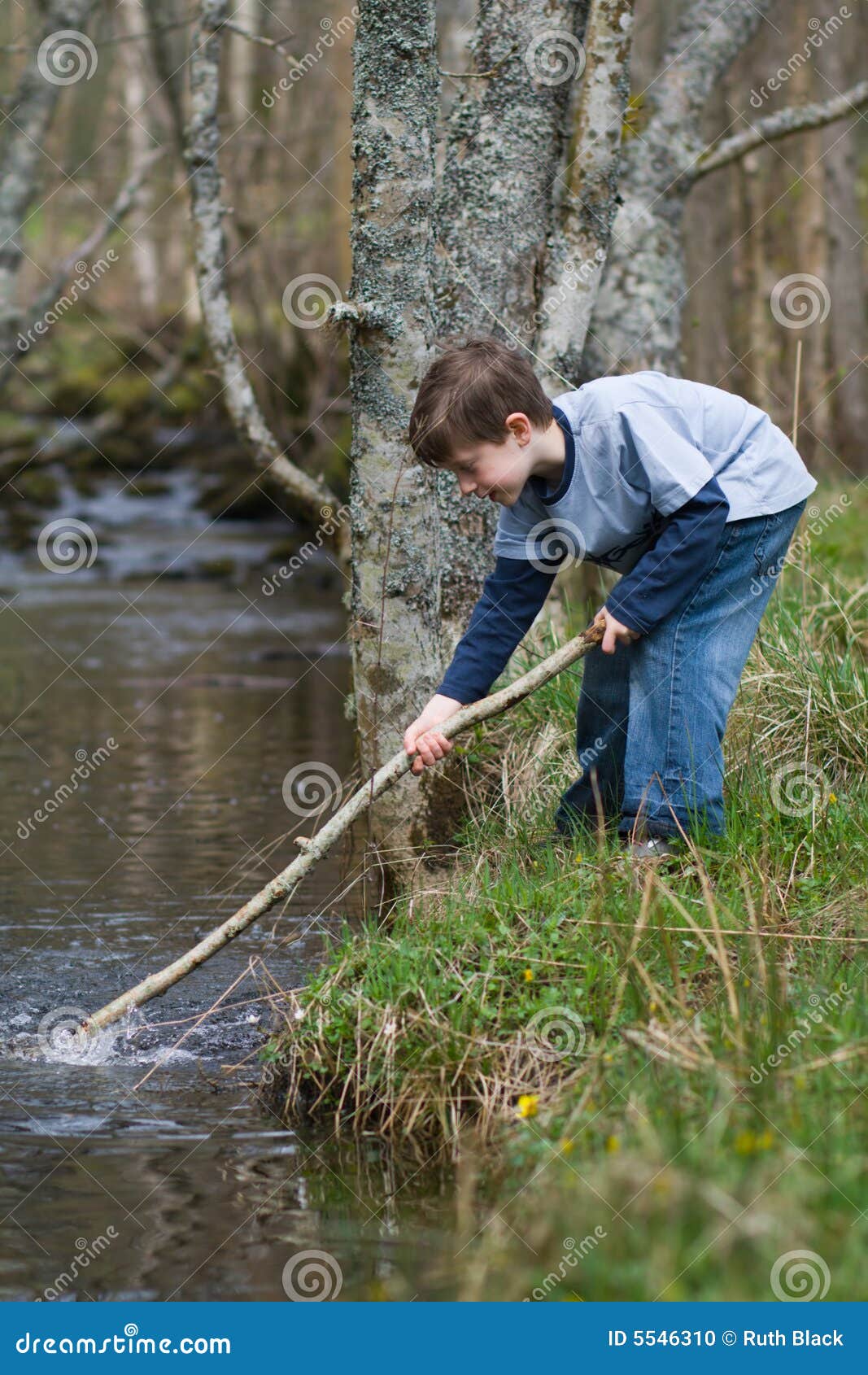 Boy playing in a stream stock photo. Image of adventure - 5546310