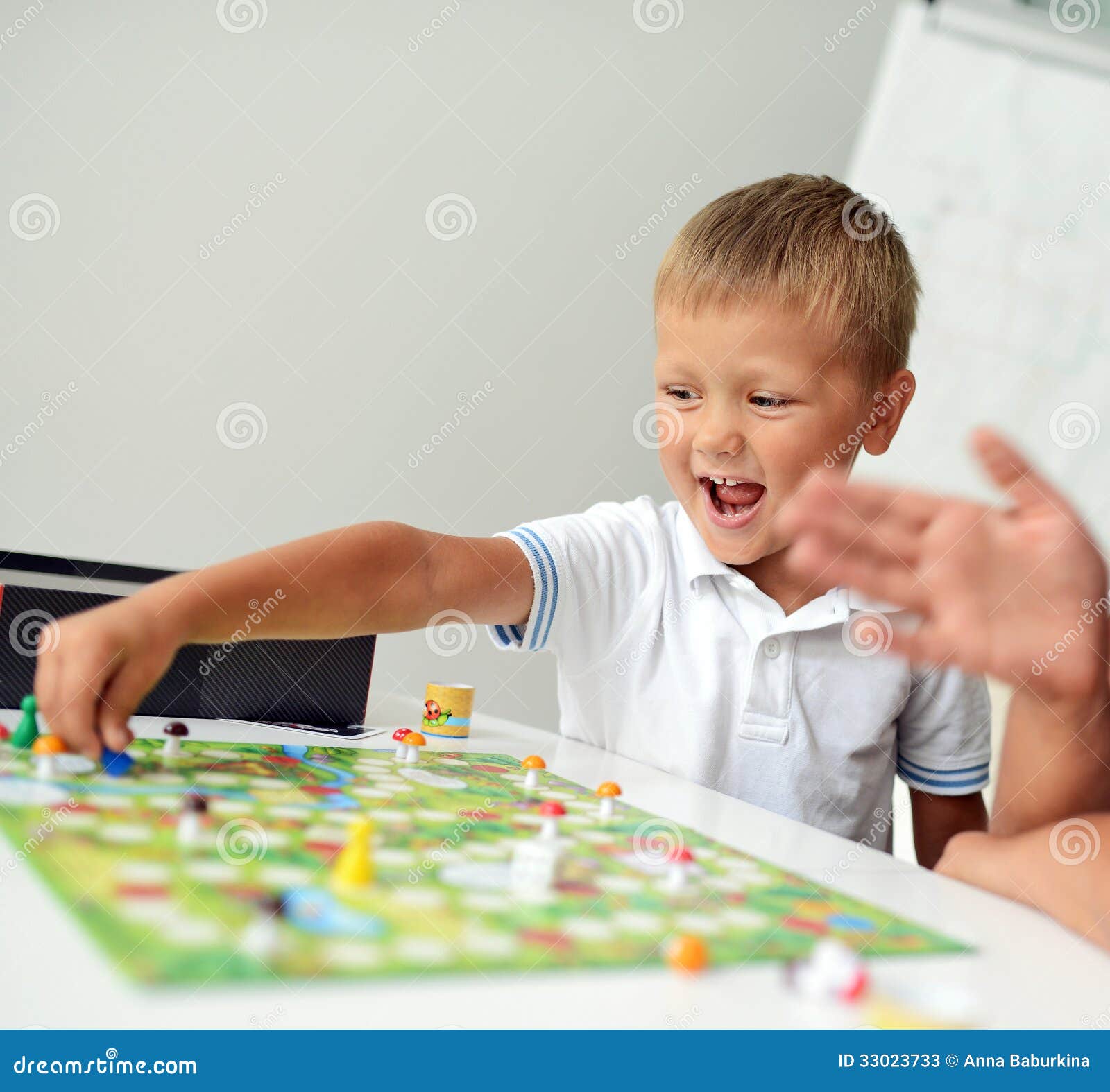 A Boy Playing with Table Game Stock Image - Image of concentrated ...