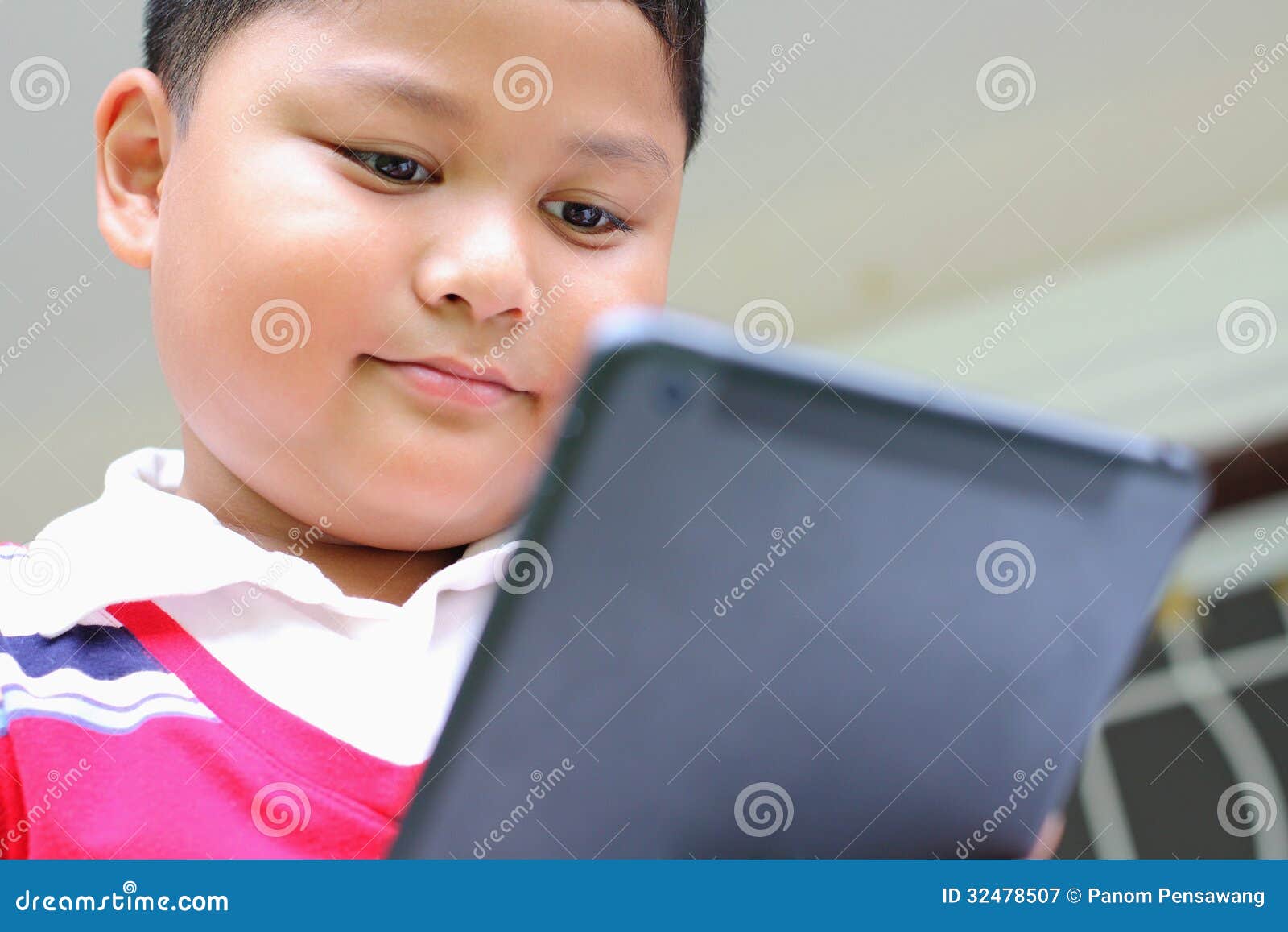 Boy playing Tablet stock image. Image of child, game - 32478507