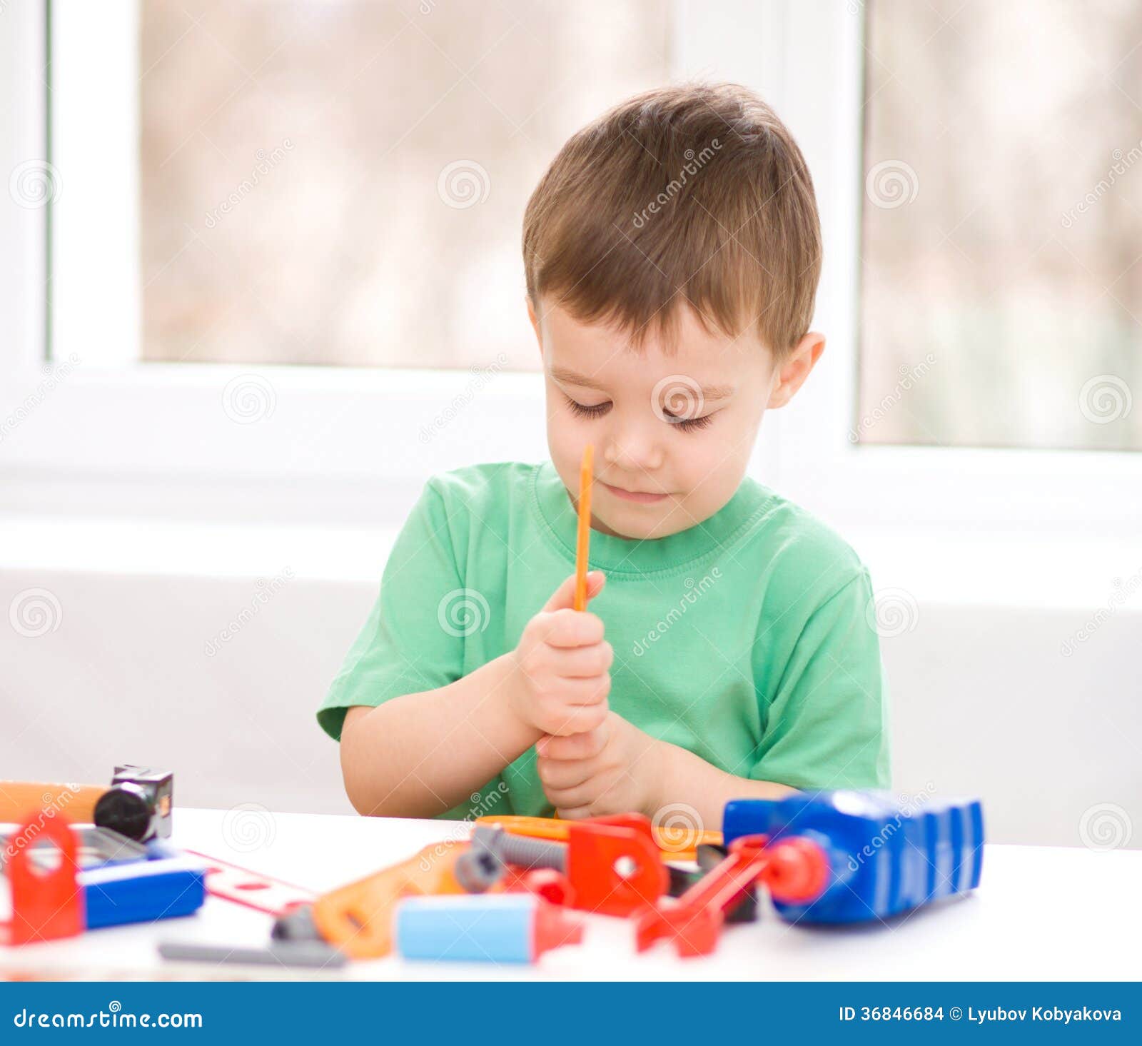 Boy is playing with tools stock photo. Image of funny - 36846684