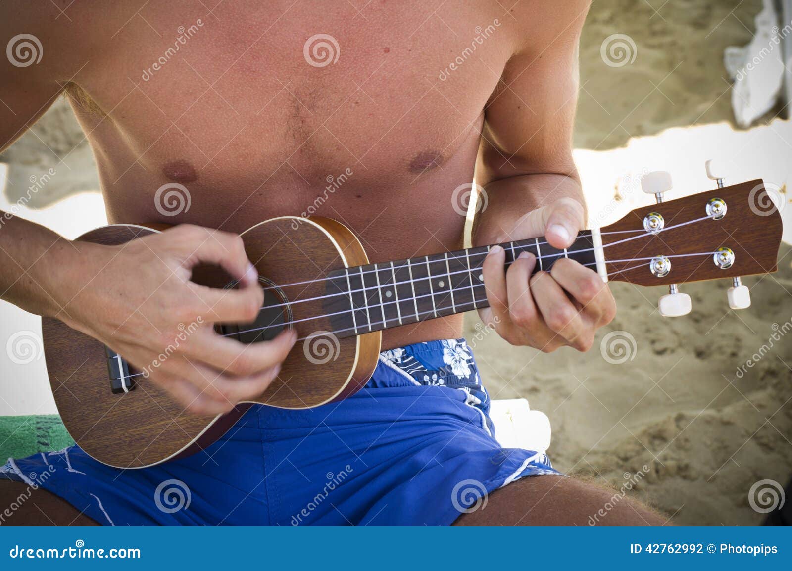 Boy playing the ukulele stock photo. Image of emotion - 42762992