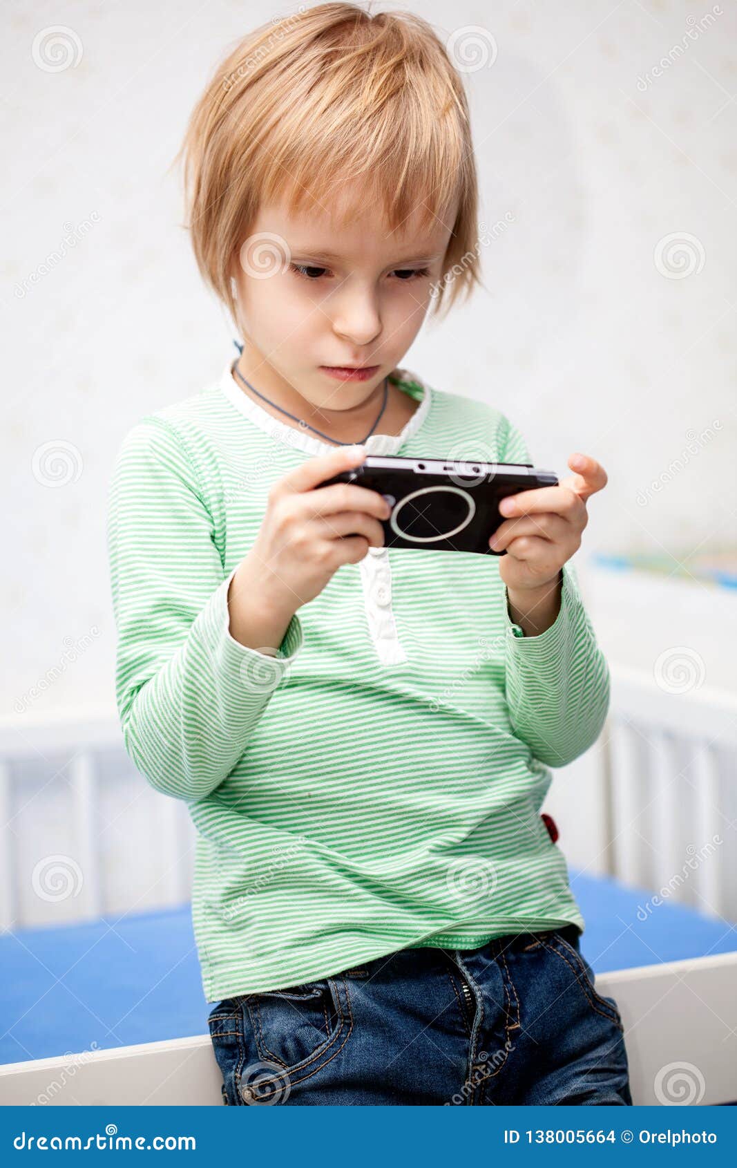 A Boy Playing a Video Game on His Game Console Stock Photo - Image of ...