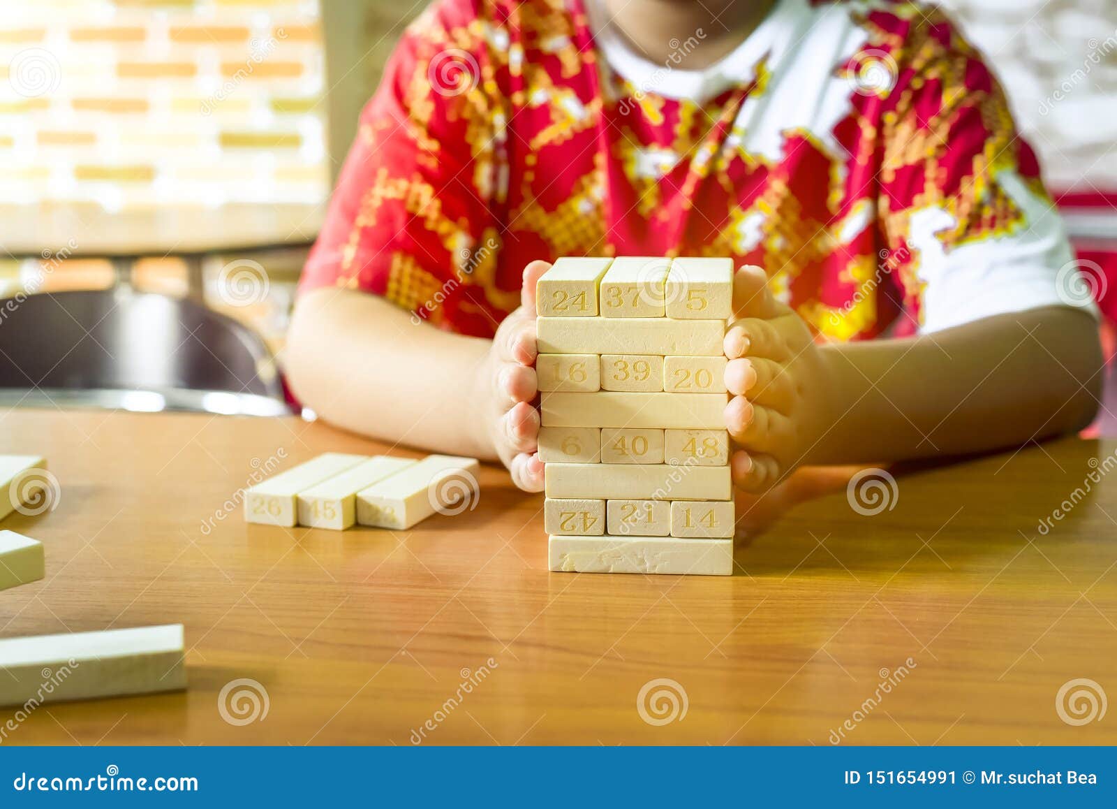 Boy is Playing Wood Blocks Stack Game by His Hand. Business Concept ...