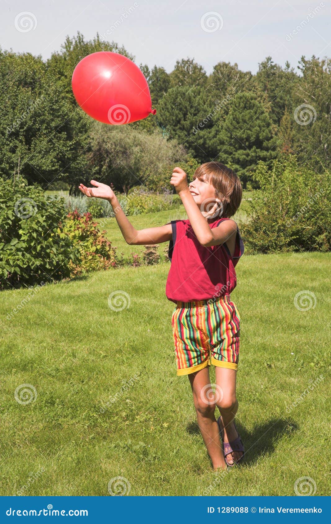 Boy plays with air-ball stock photo. Image of generation - 1289088