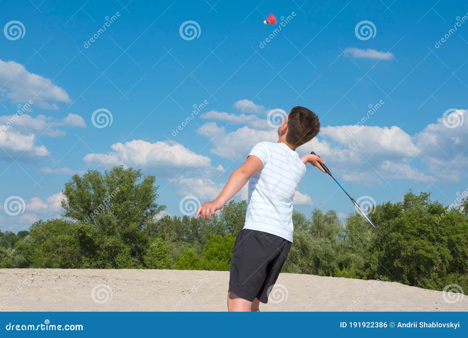 The Boy Plays Beach Badminton. View from the Back Stock Photo - Image ...