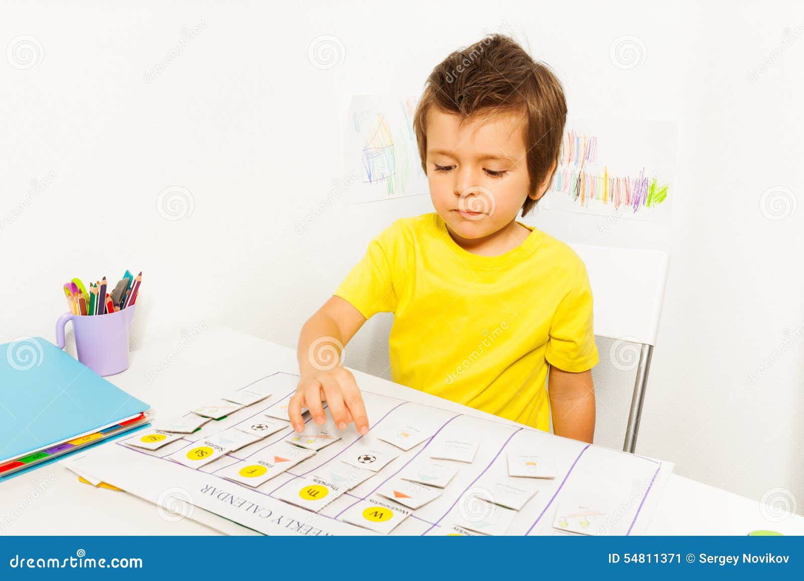 Boy Plays in Developing Game Pointing at Calendar Stock Image - Image ...