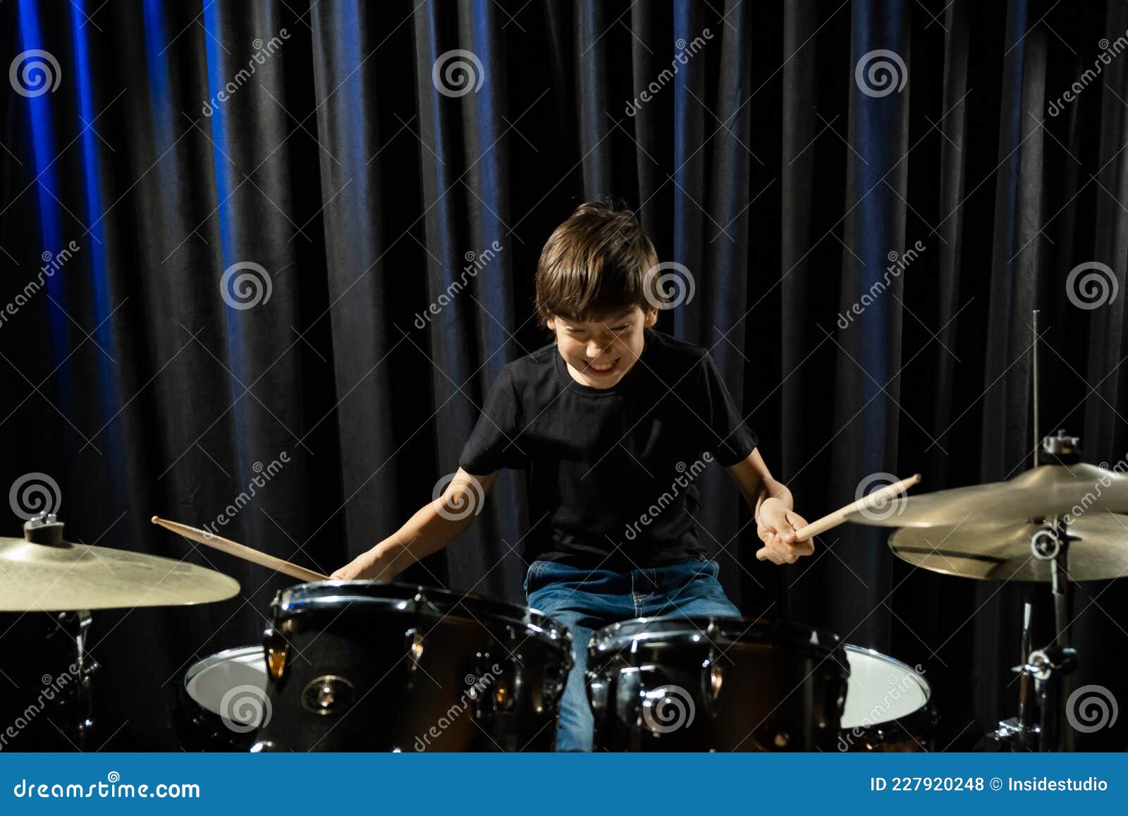 A Boy Plays Drums in a Recording Studio Stock Photo - Image of ...
