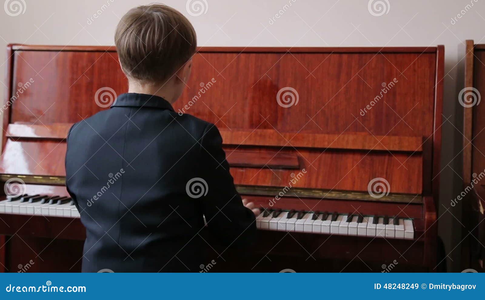 Boy plays piano, back view stock video. Video of hand - 48248249