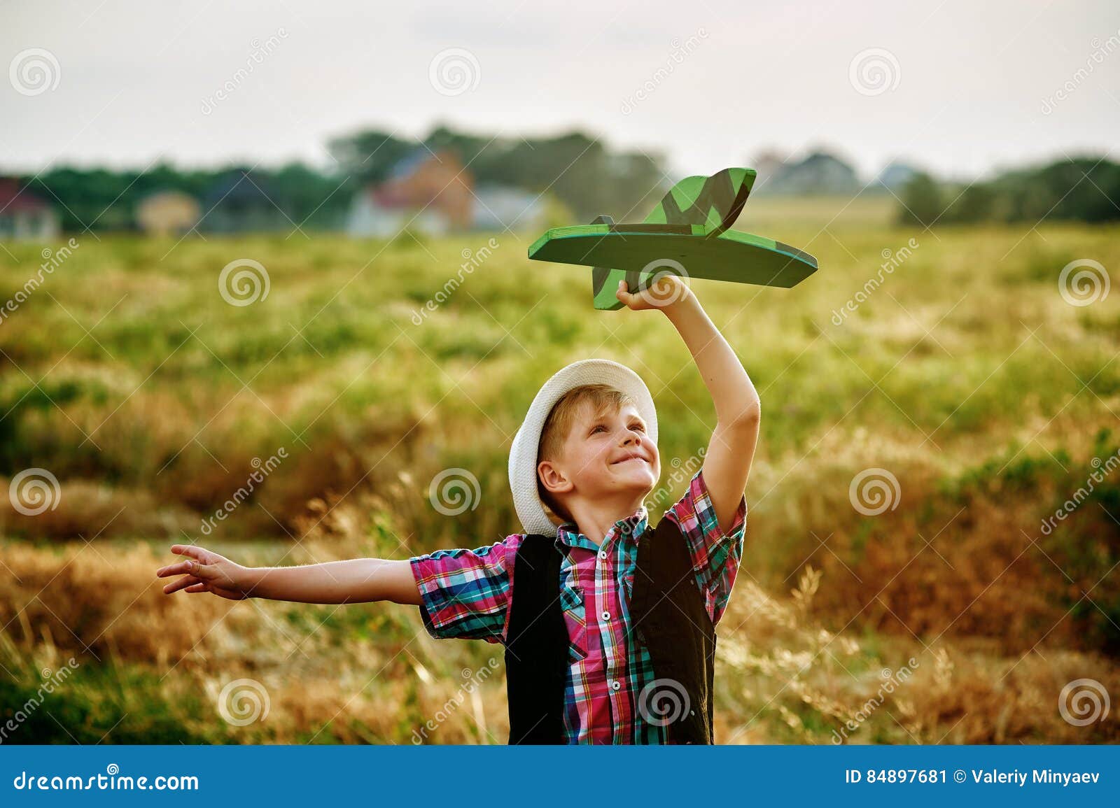 A boy plays with a plane . stock image. Image of playing - 84897681