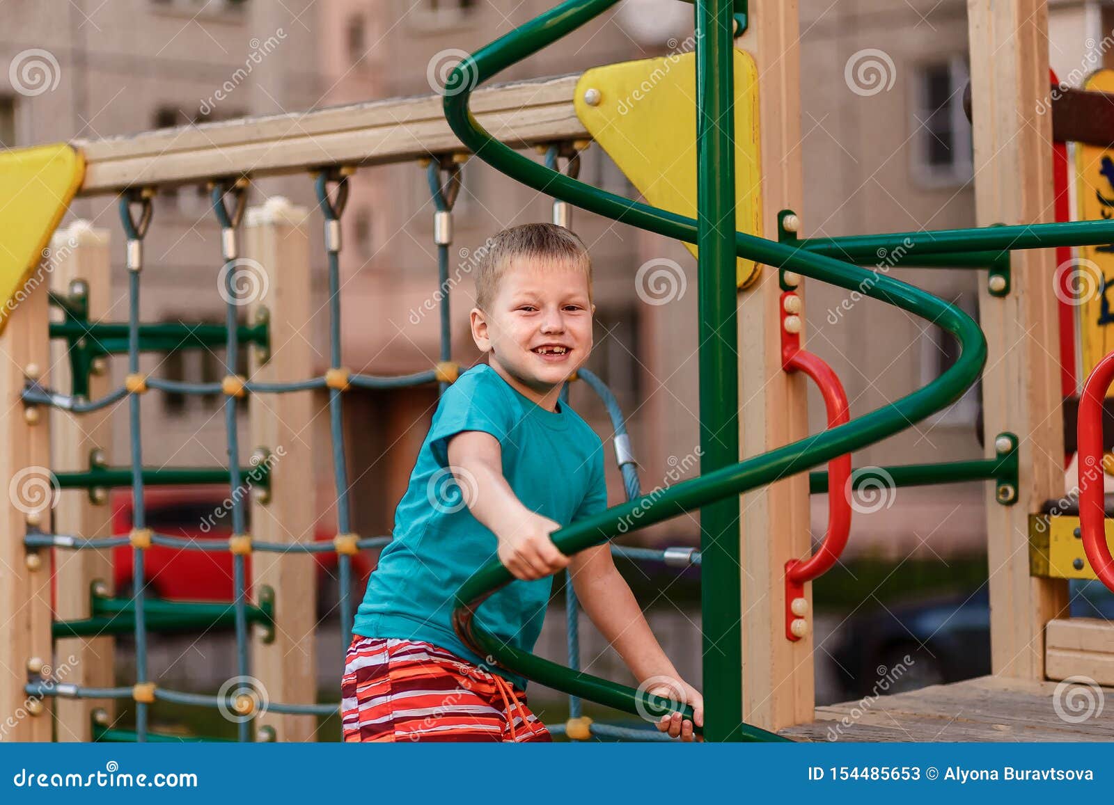 Boy Plays in the Playground Stock Image - Image of plays, lifestyle ...
