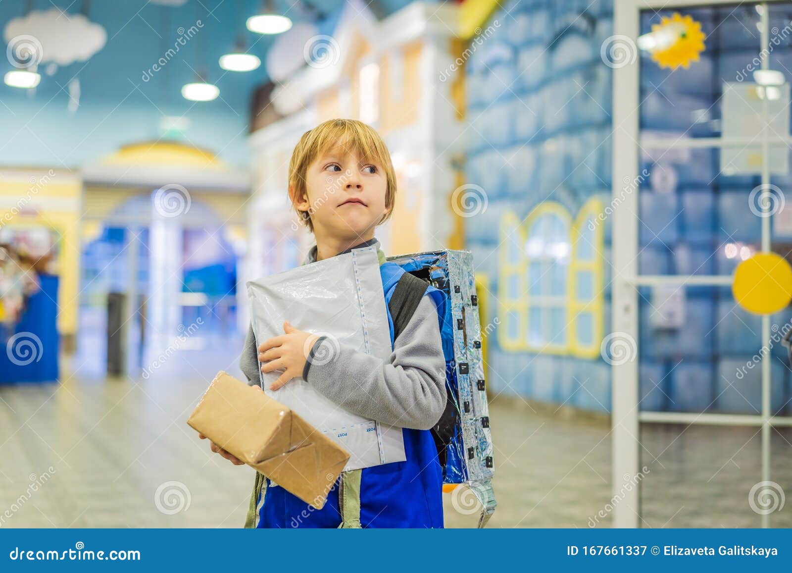 The Boy Plays that he is a Postman Stock Image - Image of mail ...