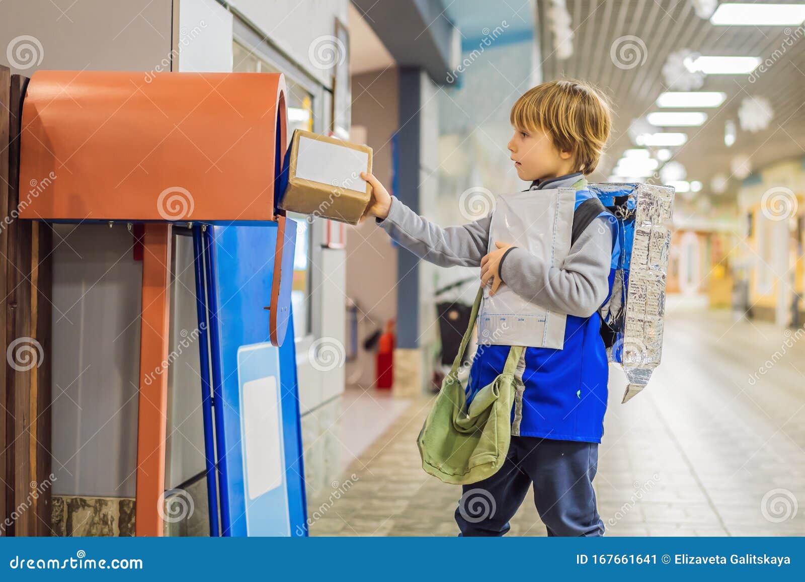 The Boy Plays that he is a Postman Stock Image - Image of mail, casual ...