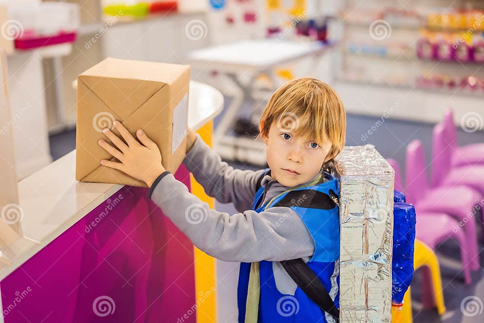 The Boy Plays that he is a Postman Stock Image - Image of envelope ...