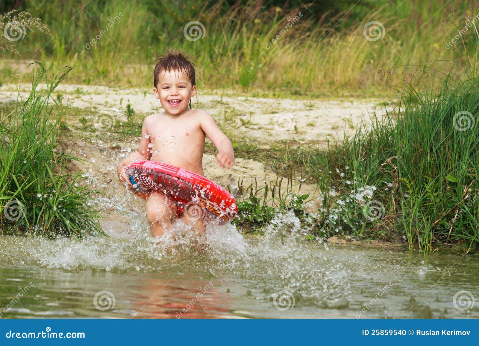 Boy Plays on the Shore of Lake Stock Photo - Image of heat, grass: 25859540