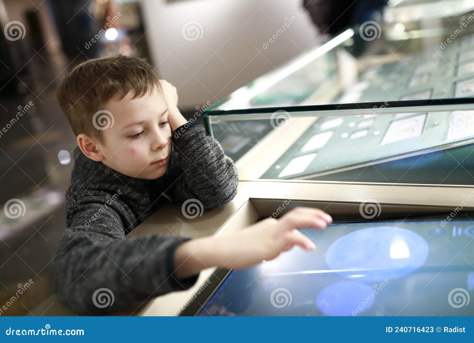 Boy Plays with Touch Screen in Entertainment Center Stock Image - Image ...