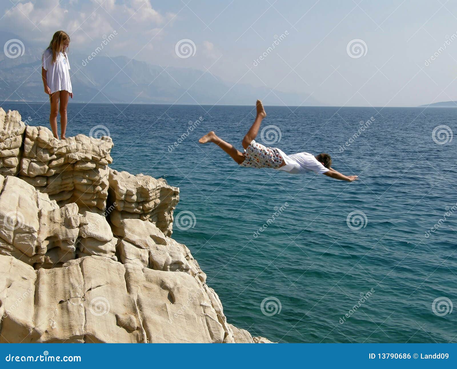 Boy plunges into the sea stock photo. Image of child - 13790686