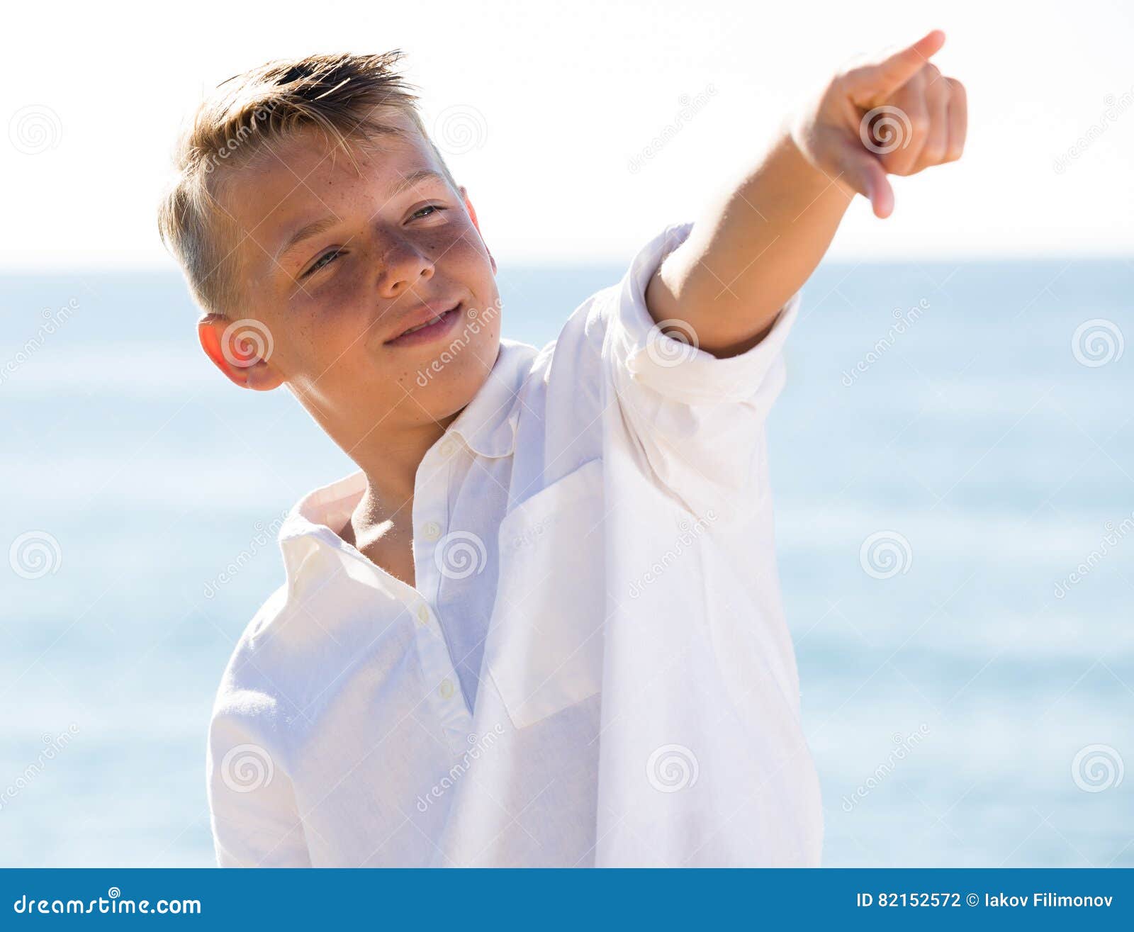 Boy pointing beach stock photo. Image of pointing, attentive - 82152572