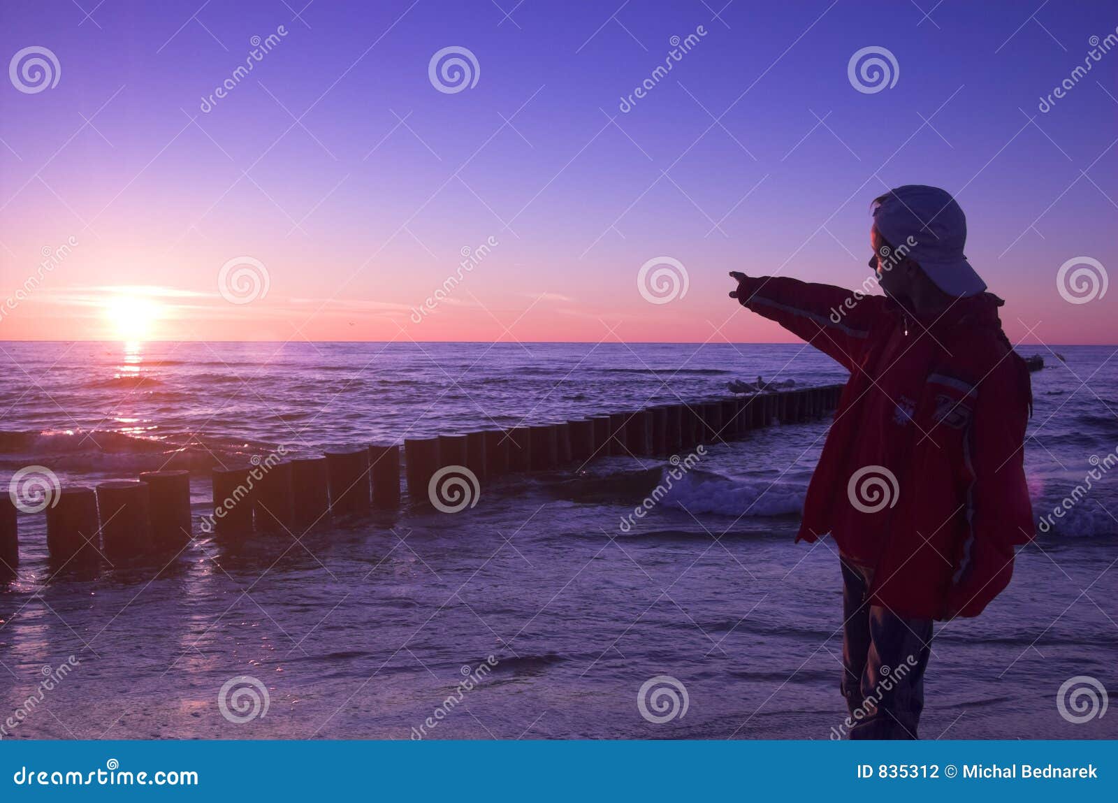 Boy pointing to sun stock photo. Image of beach, sunrise - 835312