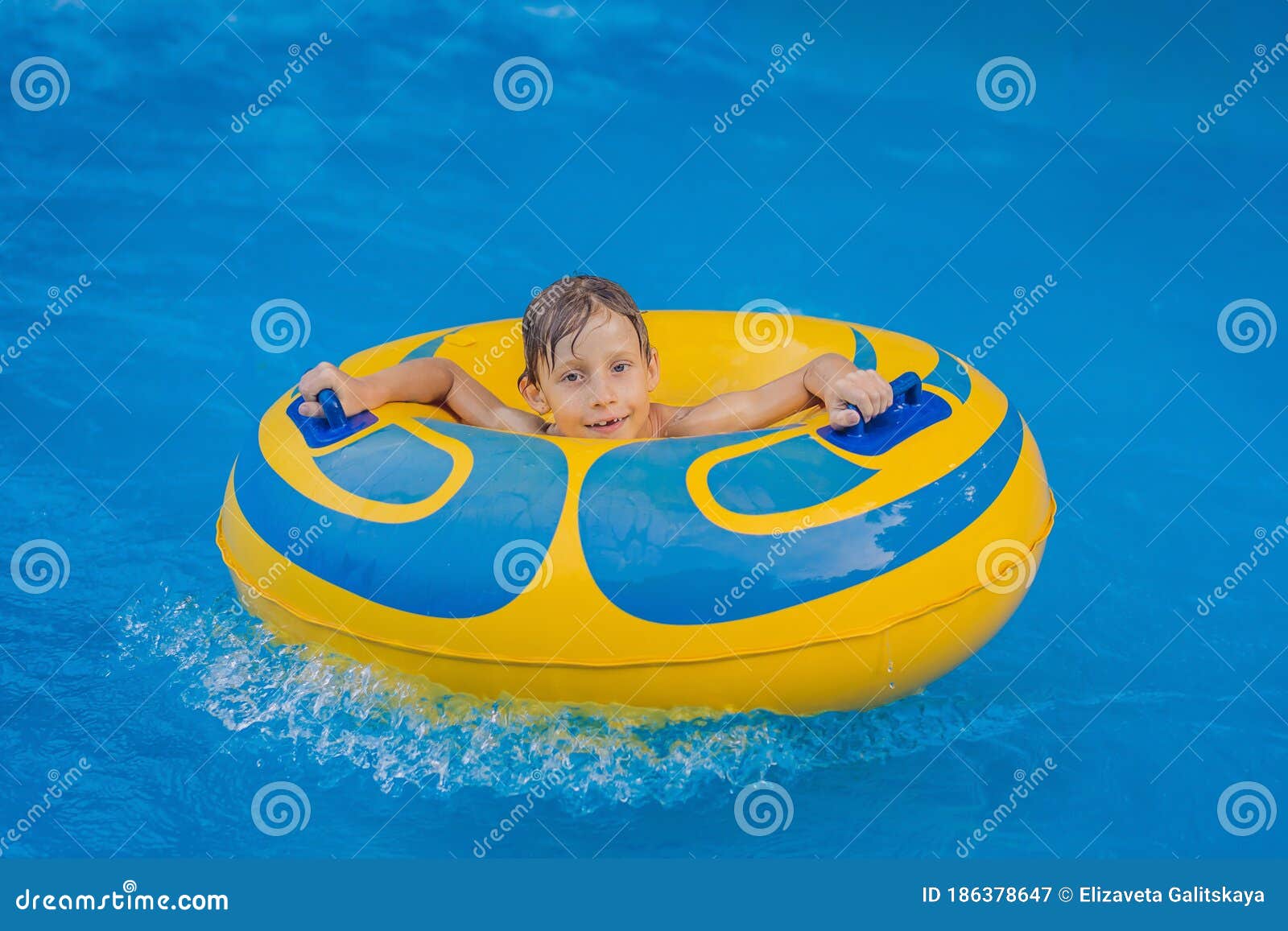 Boy on a Pool Float on Artificial Waves in a Water Park Stock Image ...