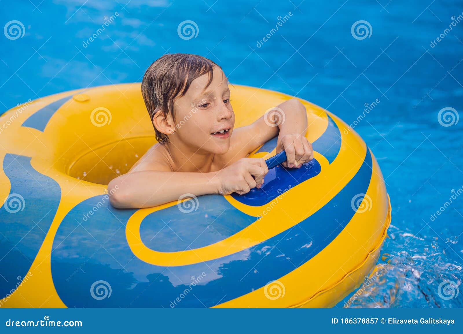 Boy on a Pool Float on Artificial Waves in a Water Park Stock Image ...