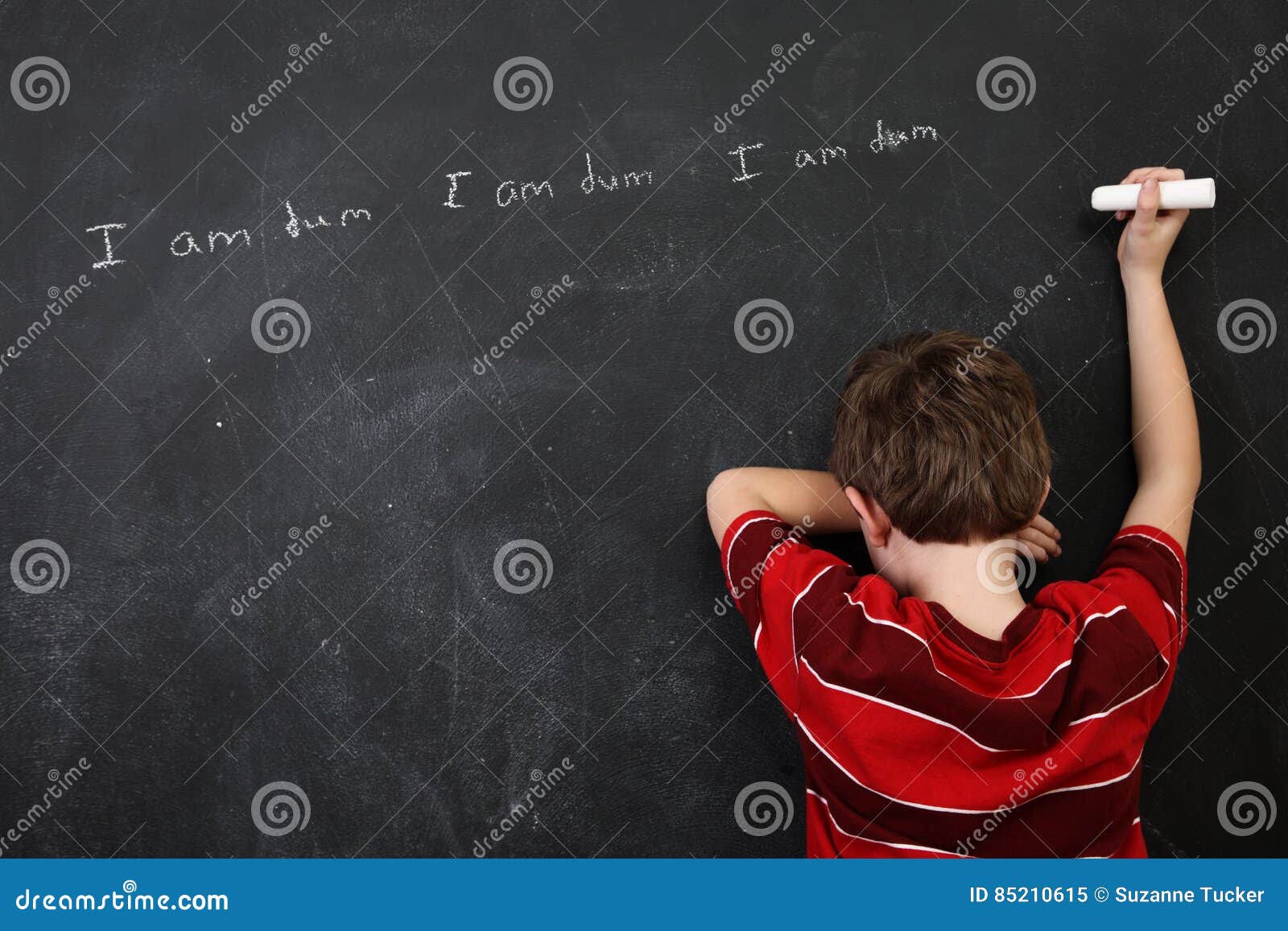 Boy with Poor Spelling and Low Self Esteem Writing on a Blackboard ...