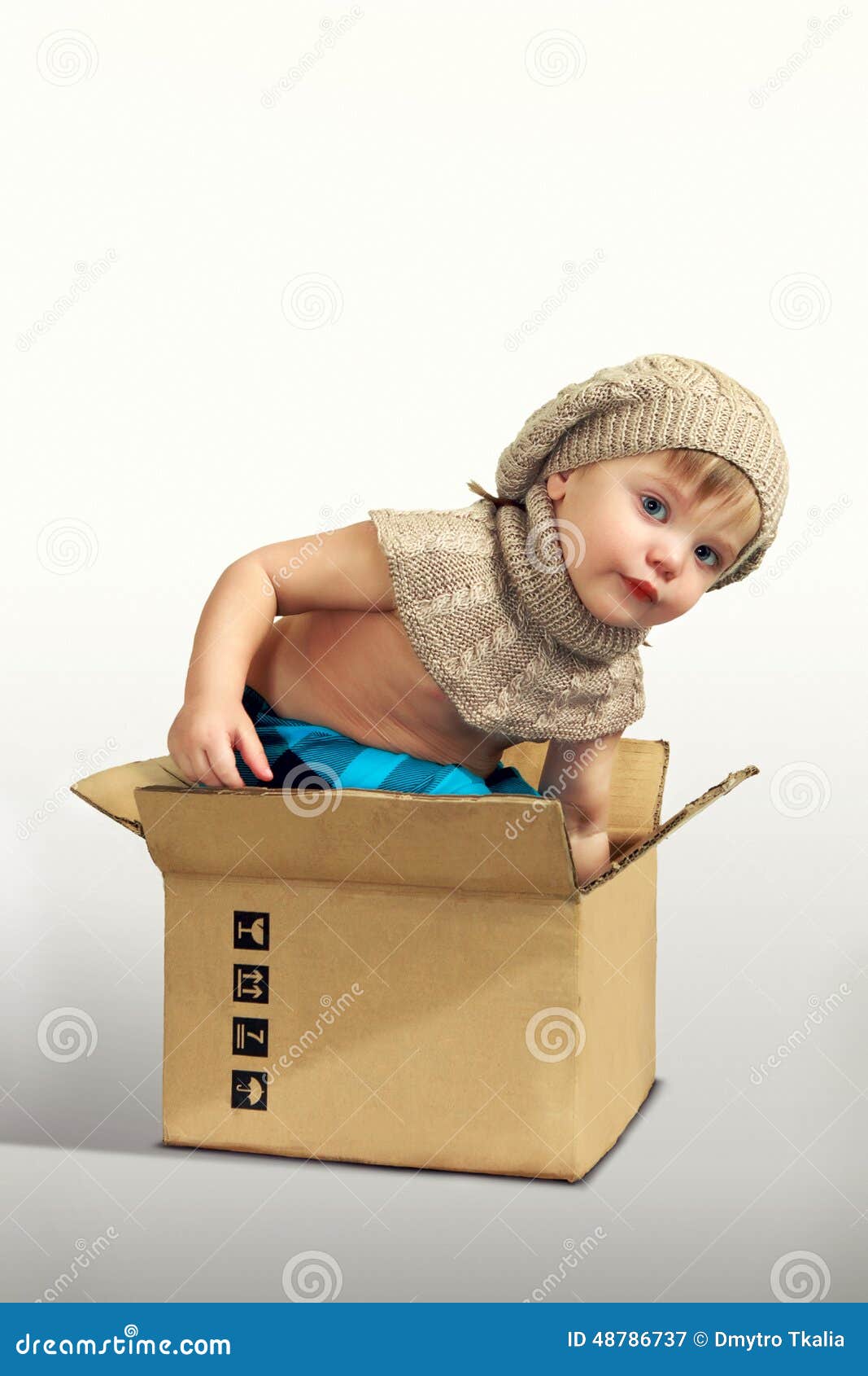 Boy posing in box stock image. Image of clothes, grey - 48786737