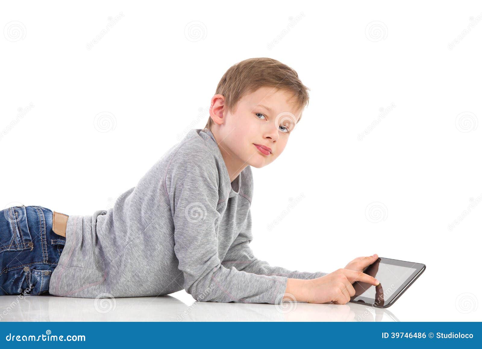 Boy posing with a tablet. stock photo. Image of camera - 39746486