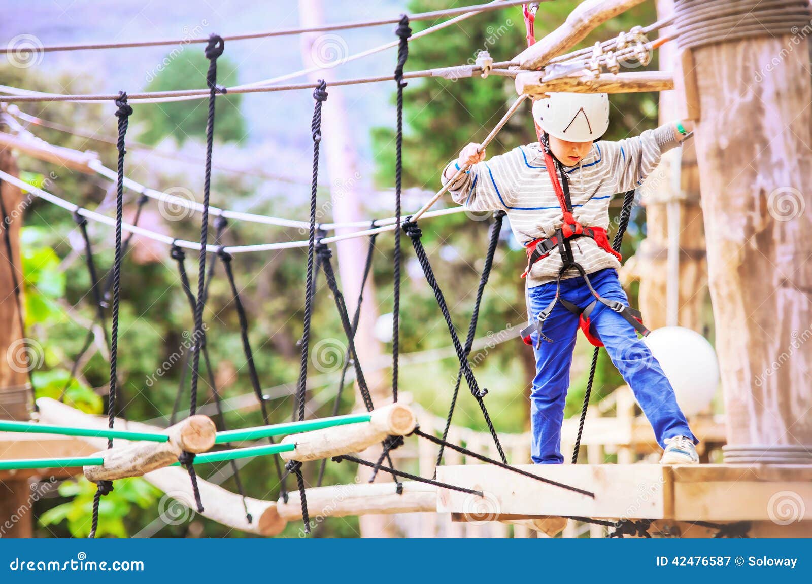 Boy Practicing Air Track in Rope Park Stock Image - Image of helmet ...