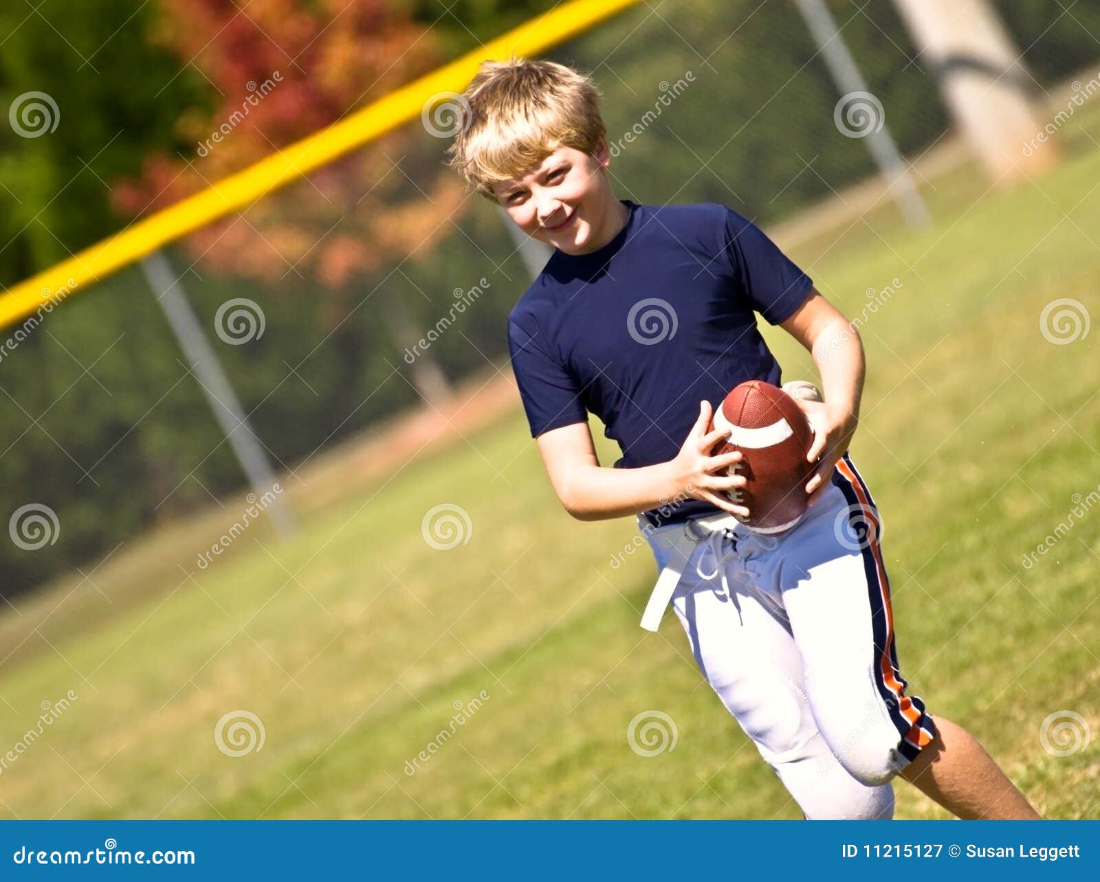 Boy Practicing Football stock image. Image of game, childhood - 11215127