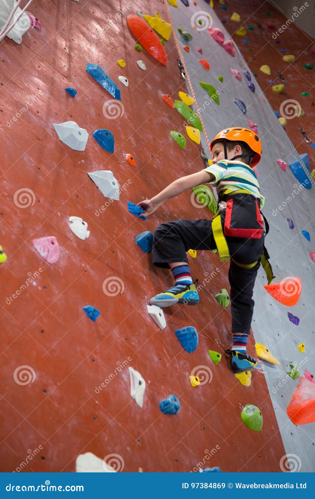 Boy Practicing Rock Climbing in Fitness Studio Stock Image - Image of ...