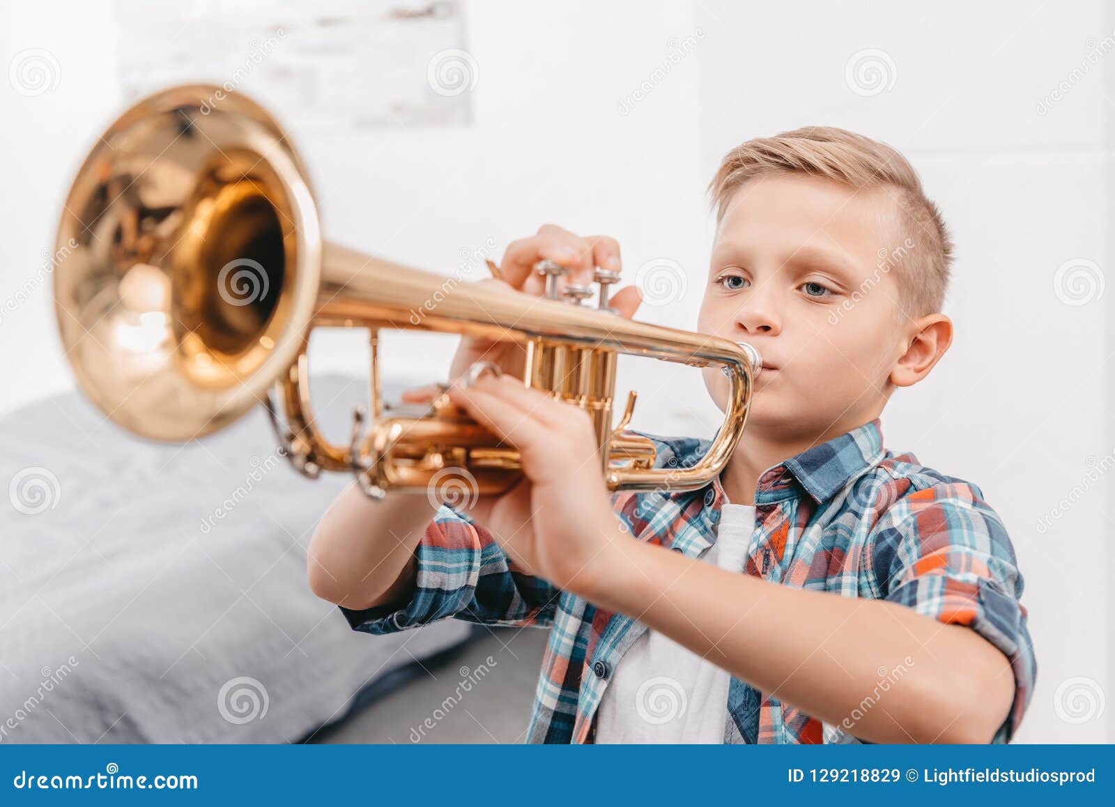 Young Boy Practicing Playing Trumpet in Living Room Stock Image - Image ...