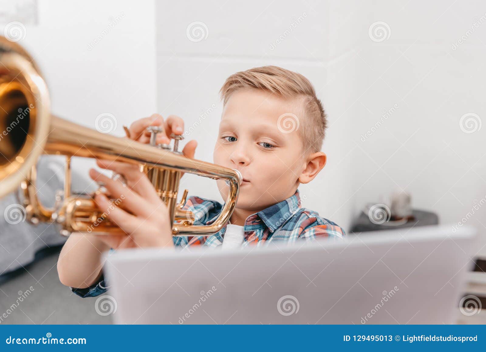 Young Boy Practicing Playing Trumpet in Living Room Stock Image - Image ...