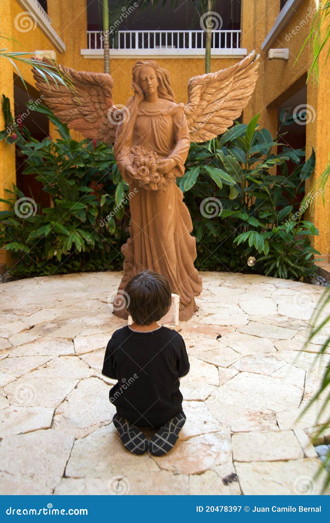 Boy Praying in Front of an Angel Stock Image - Image of believe, statue ...