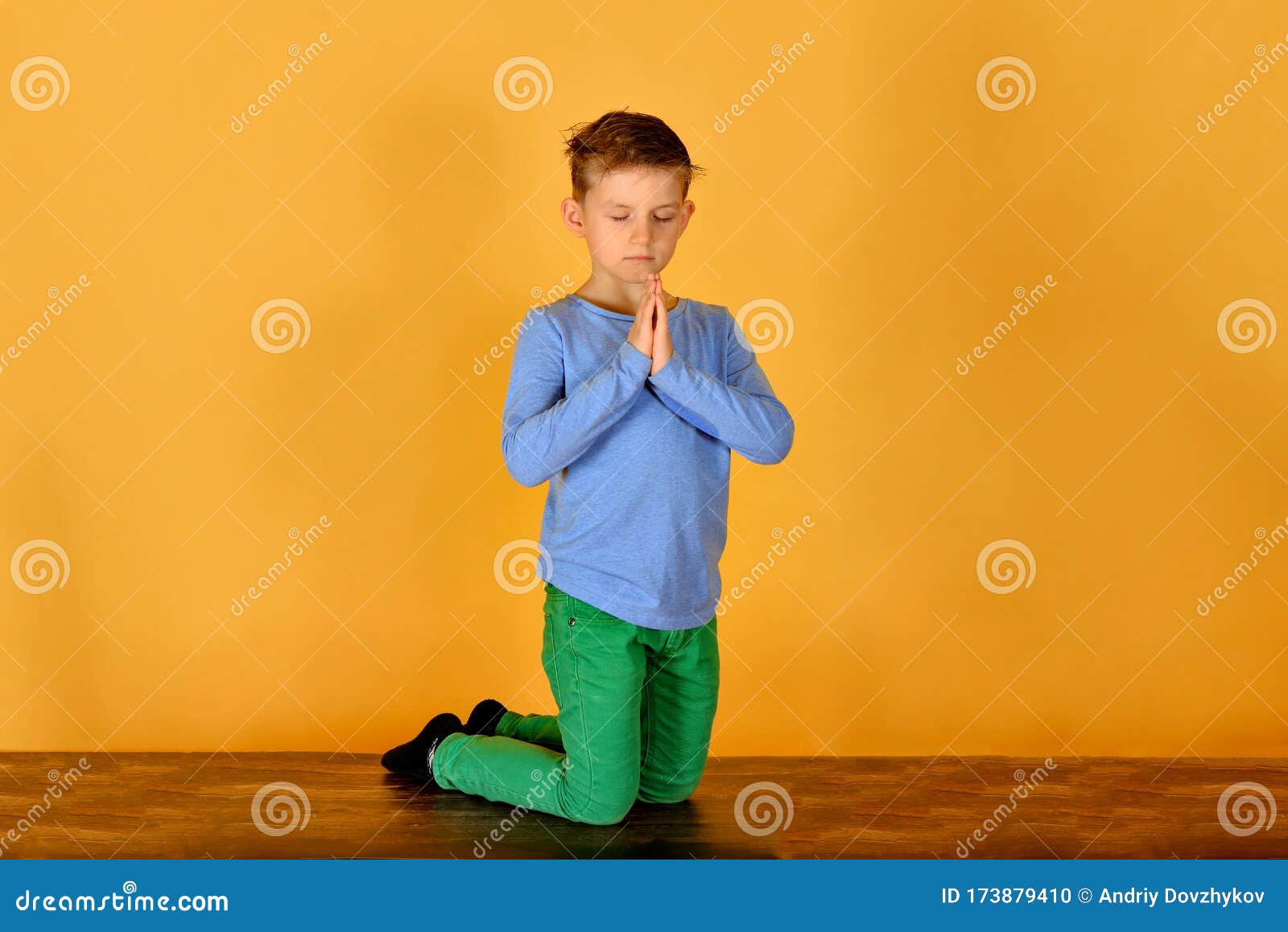 A Boy Prays Kneeling, Religious and Devout Children Stock Photo - Image ...