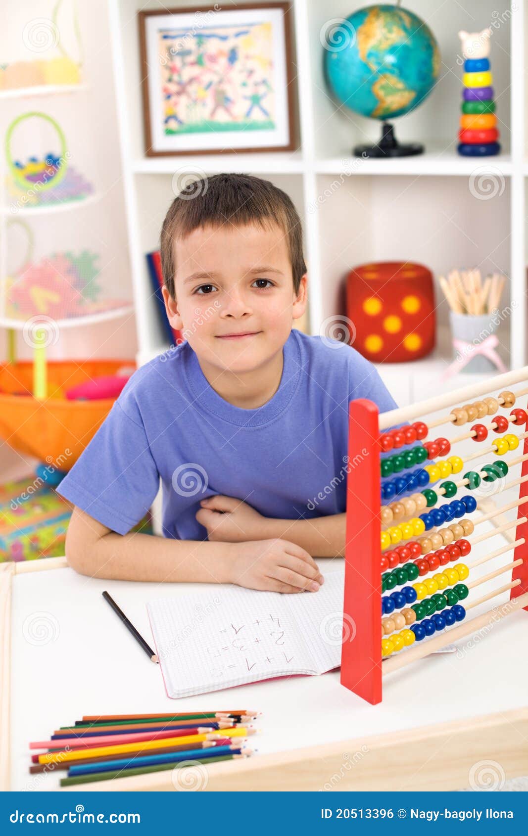 Boy Preparing for Elementary School Stock Photo - Image of table ...