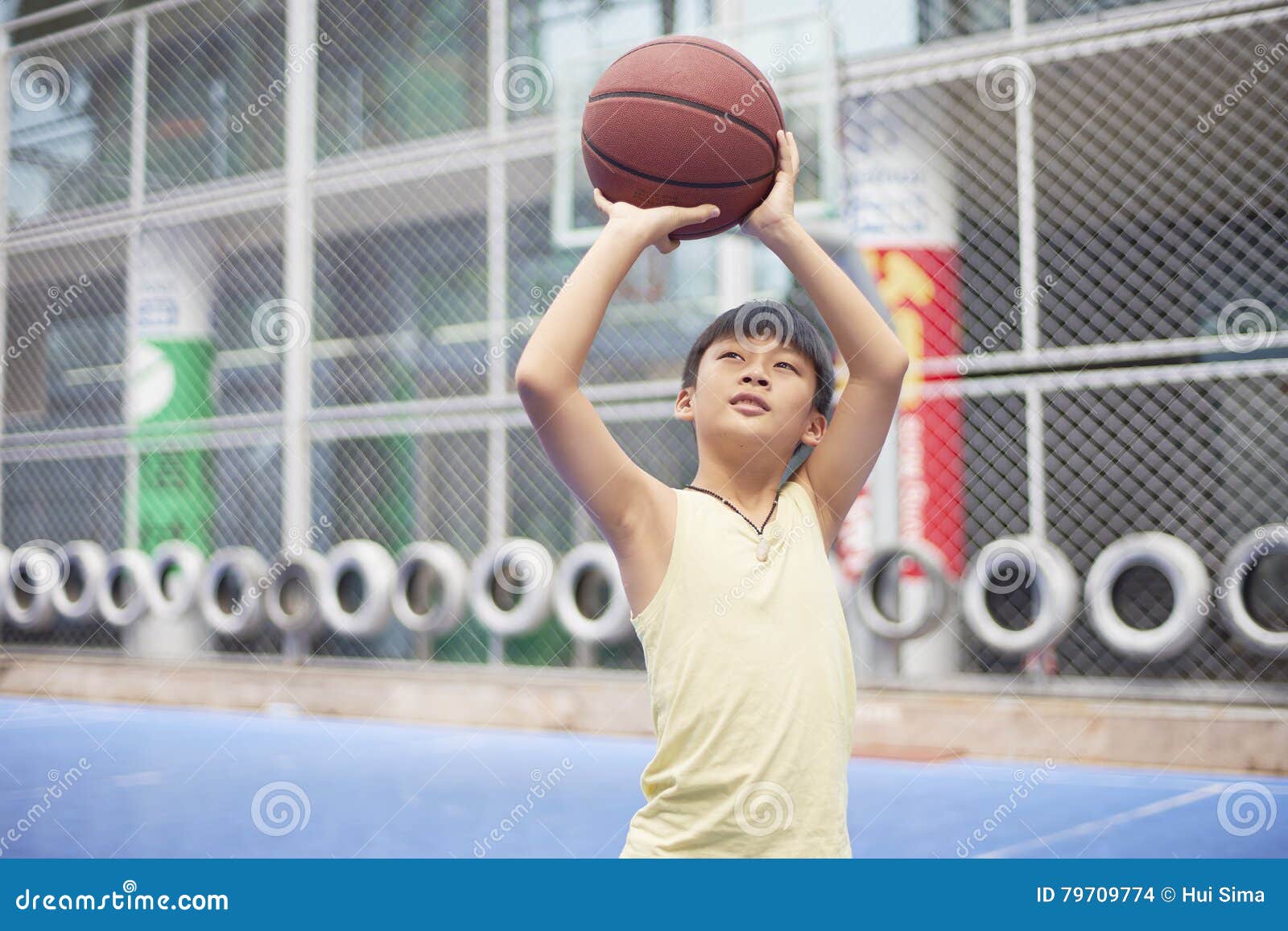 Boy Preparing for Shooting at Basketball Court Stock Photo - Image of ...