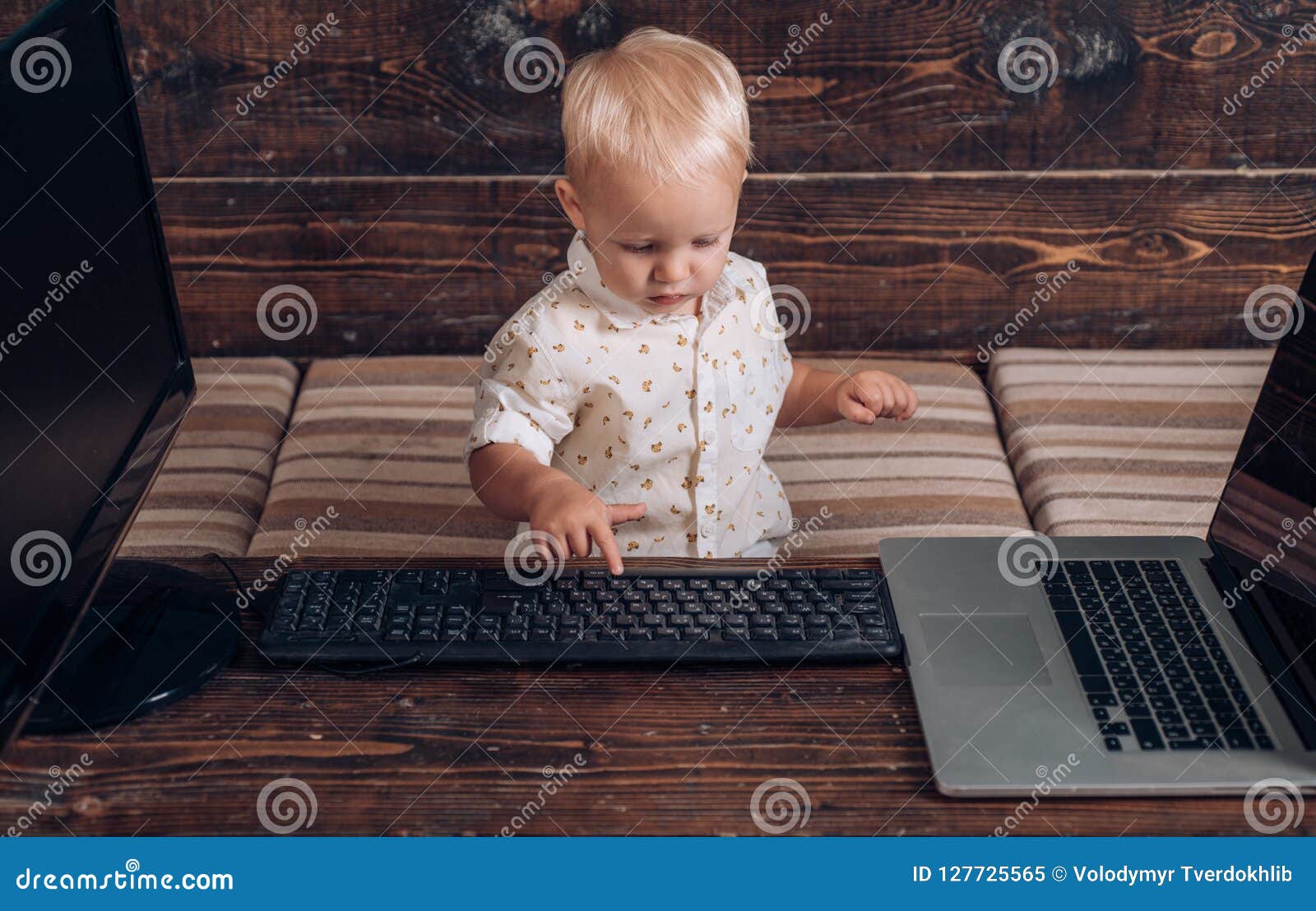 Boy Programming on Computer with Multiple Monitors and Laptop on Desk ...