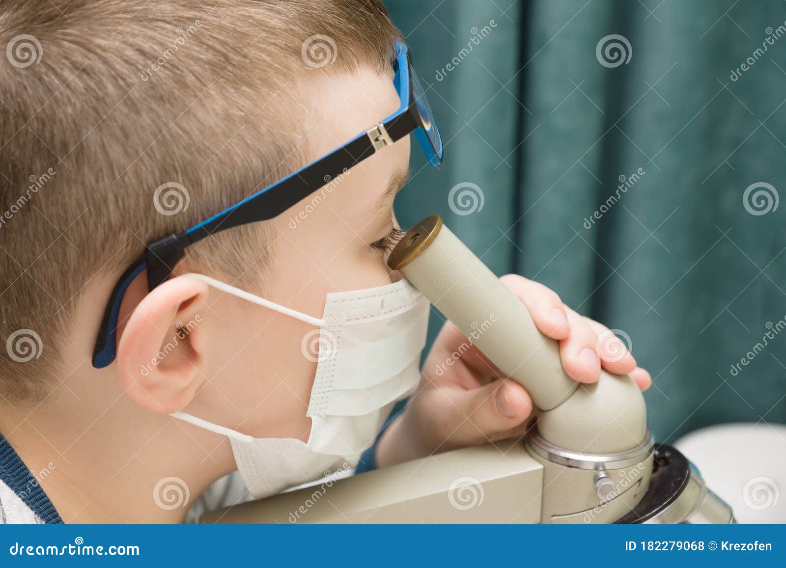 Boy in a Protective Mask Studies a Microscope Stock Photo - Image of ...