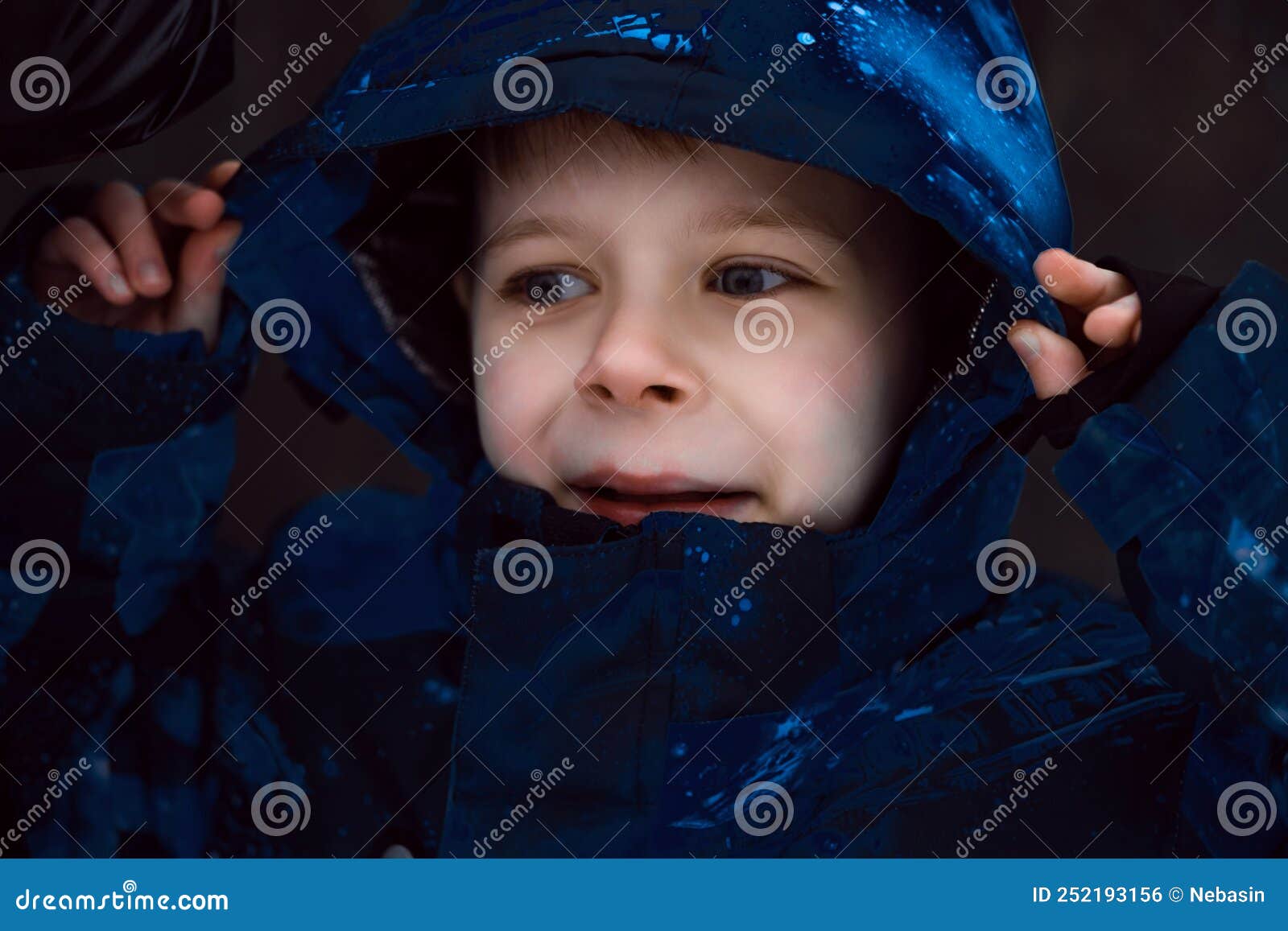 The Boy Pulled the Hoodie in His Jacket Over His Head Stock Photo ...