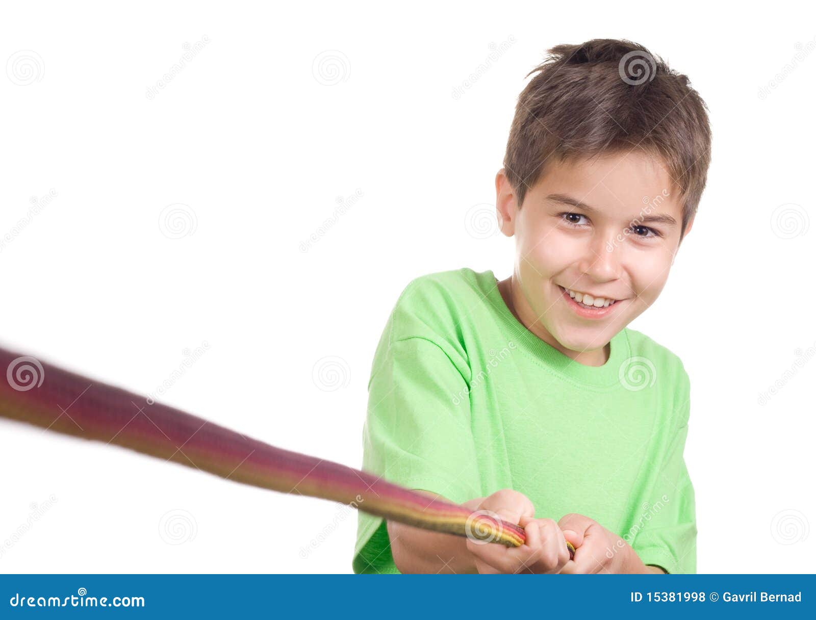 Boy pulling a rope stock photo. Image of holding, move - 15381998