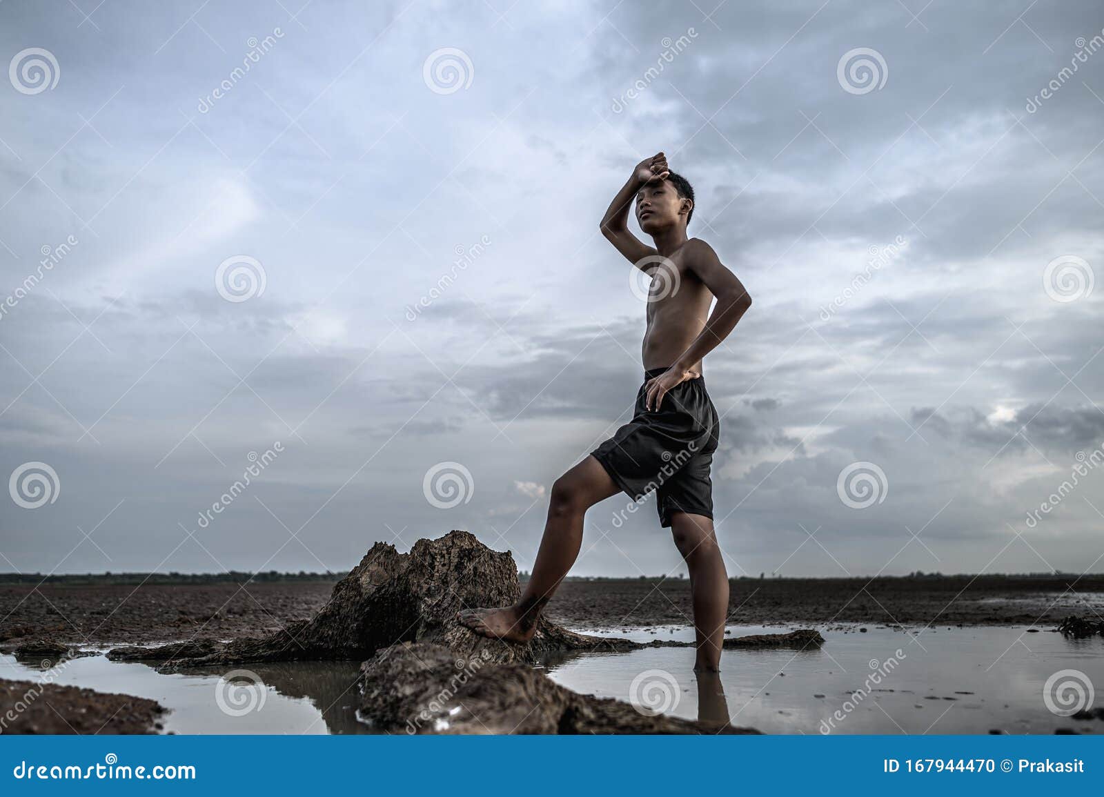 The Boy Put His Hands on the Forehead and Stood on the Base of the Tree ...