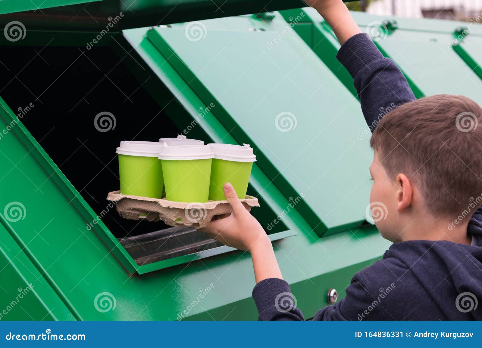 Boy Puts Used Paper Cups in the Trash after Lunch Stock Image - Image ...