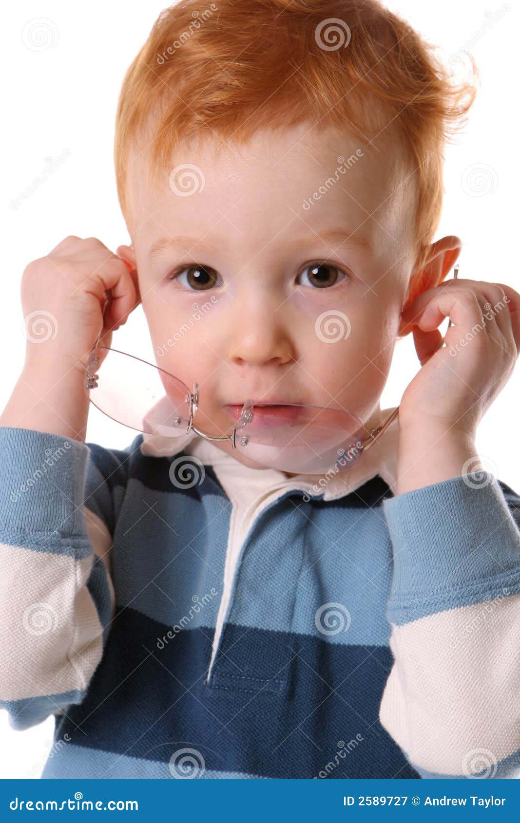 Boy putting on glasses stock image. Image of vision, glasses - 2589727