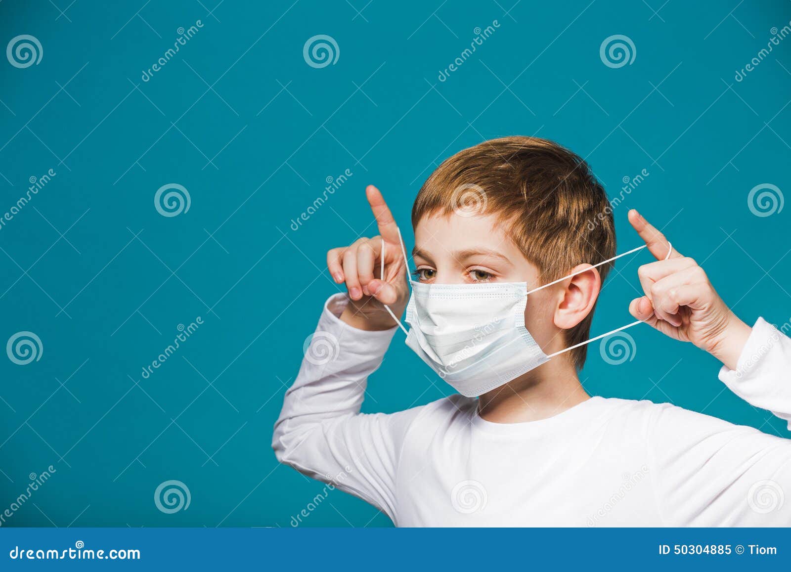 Boy Putting on Protection Mask Stock Image - Image of medical, young ...