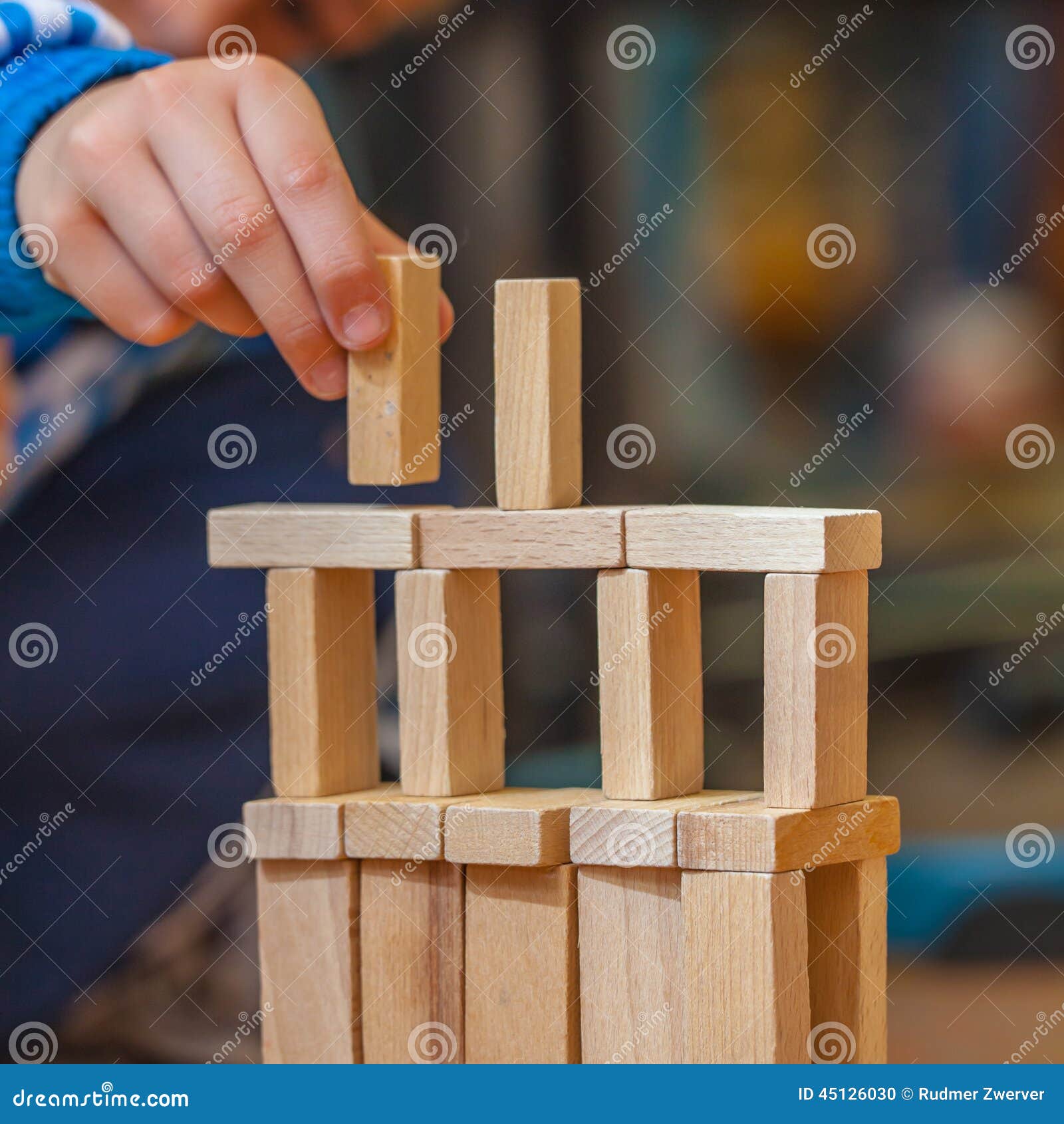 Boy Putting Wooden Building Block on a Constuction Stock Photo - Image ...